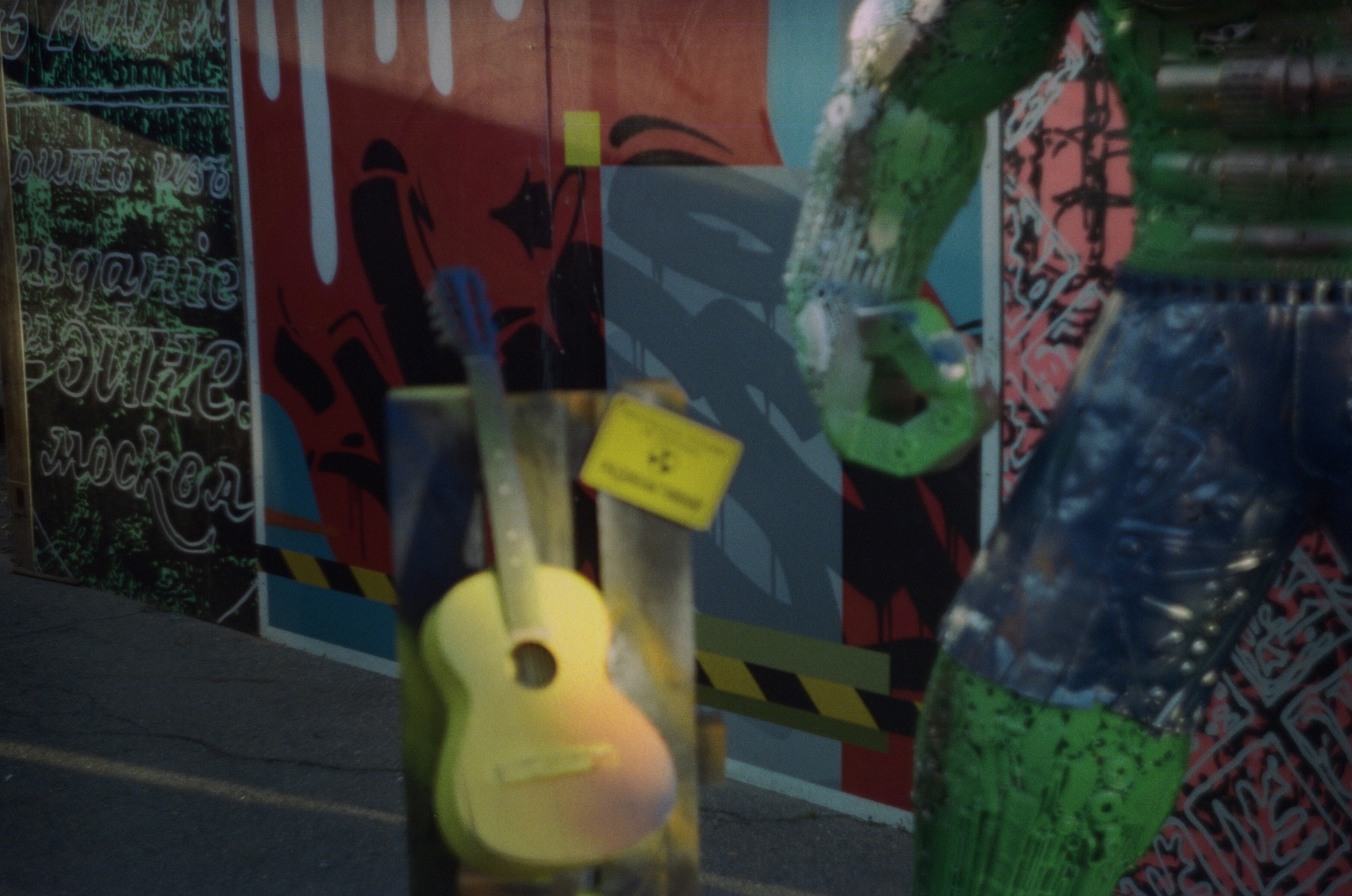 Neon Graffiti Guitar Stand in Twilight Alley