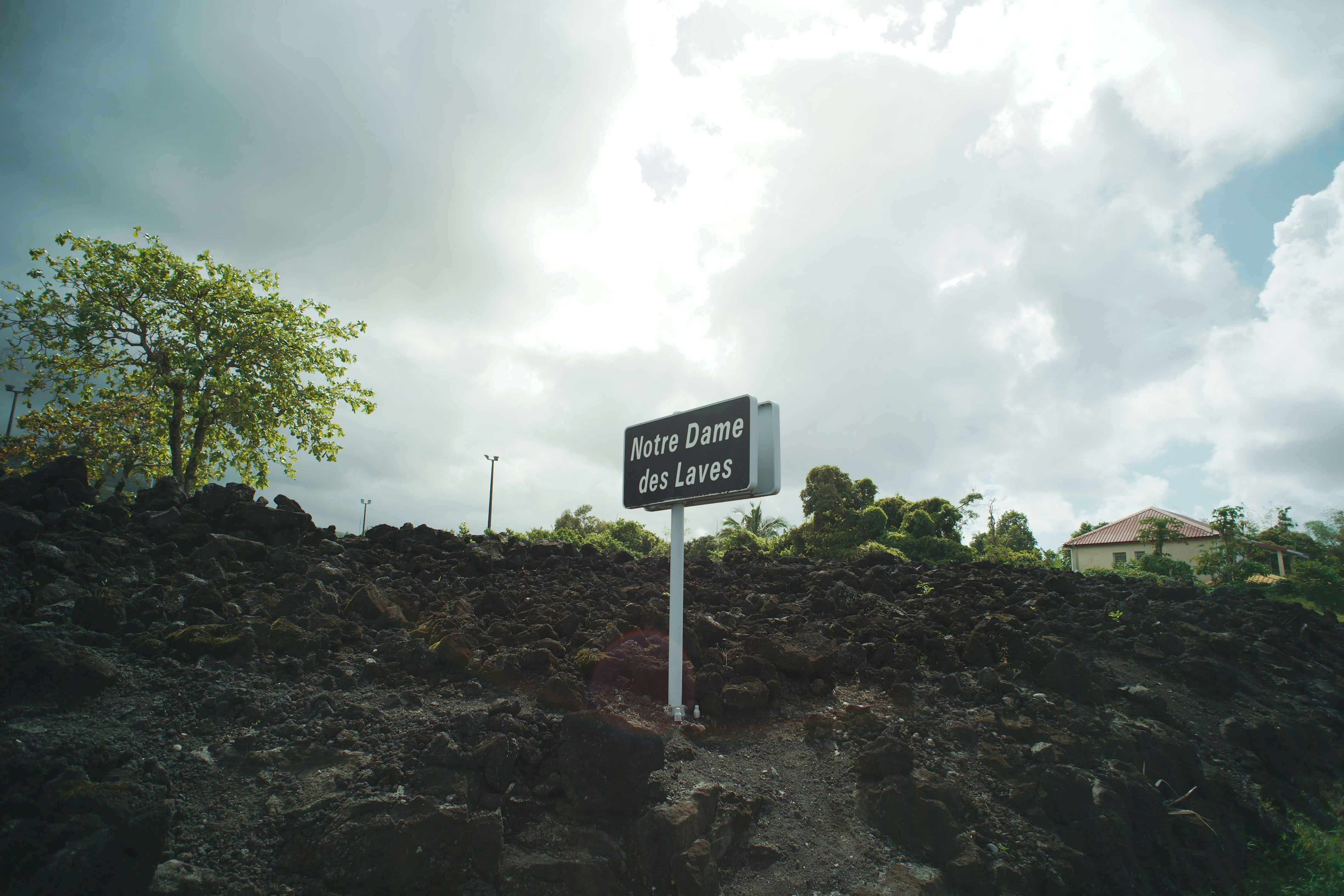Signpost on volcanic terrain in bright daylight