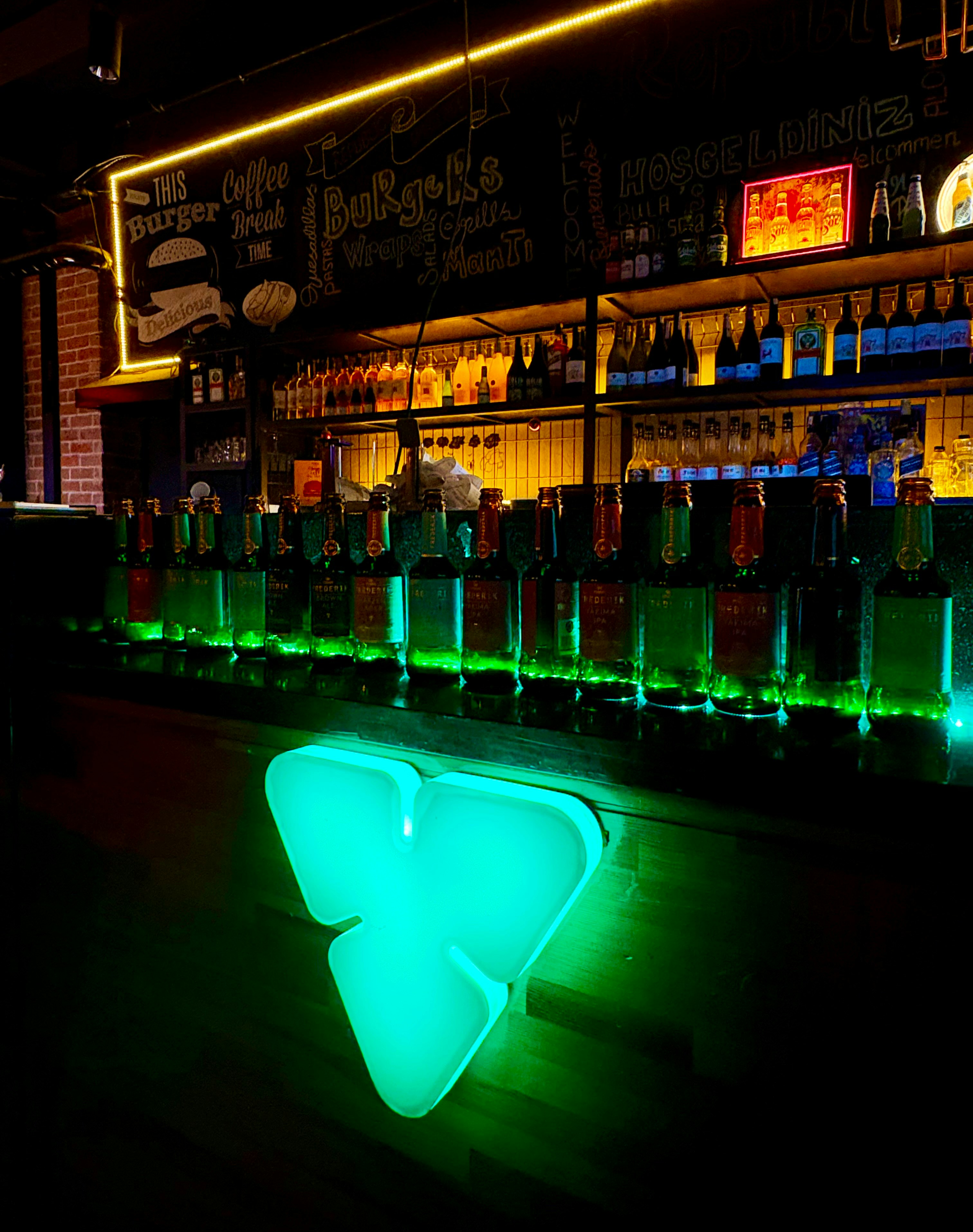Neon Chaser at the Bar: Green Glass and a Glowing Arrow