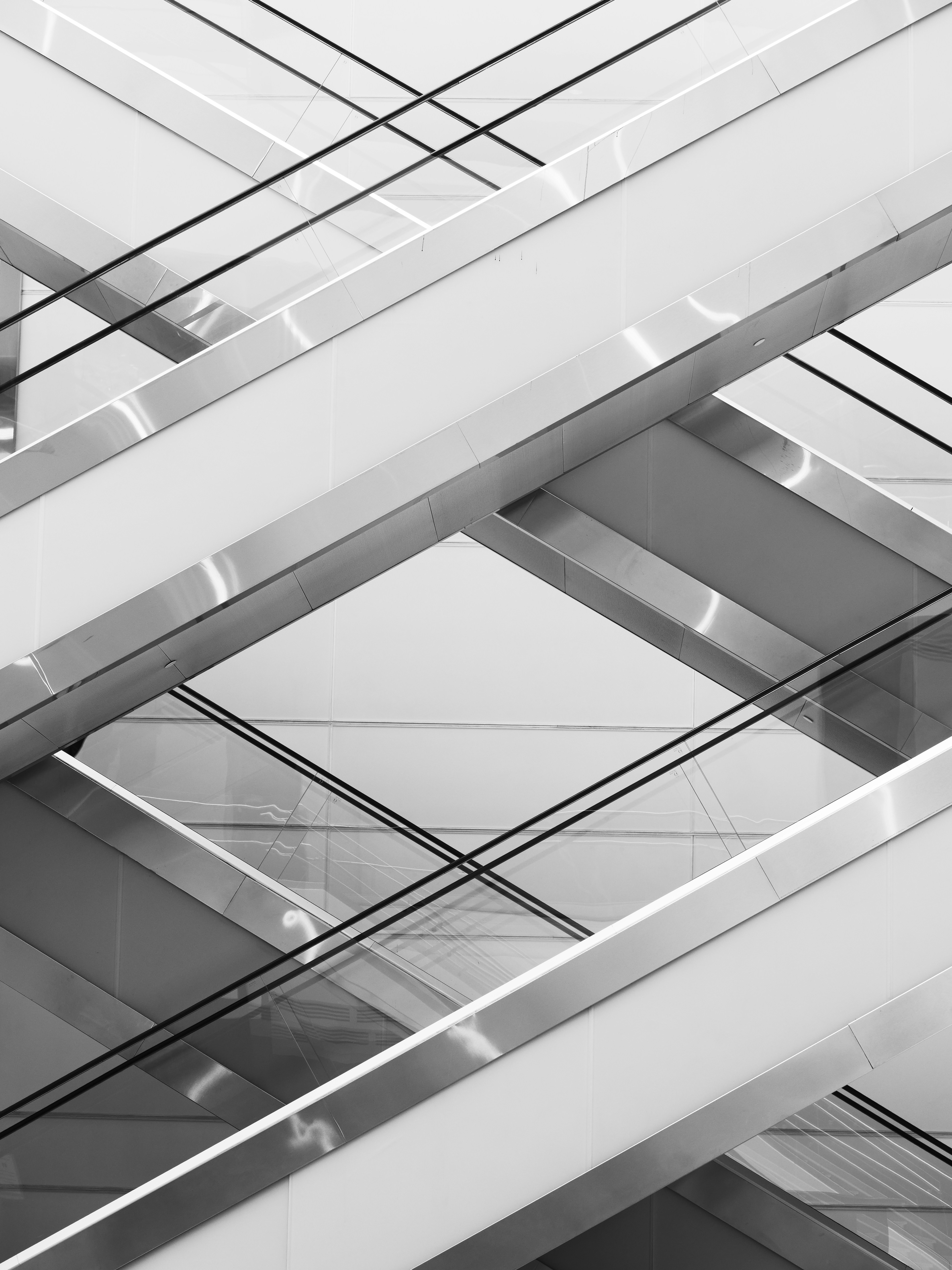 Crisscrossing Arches: Monochrome Stairwell Geometry