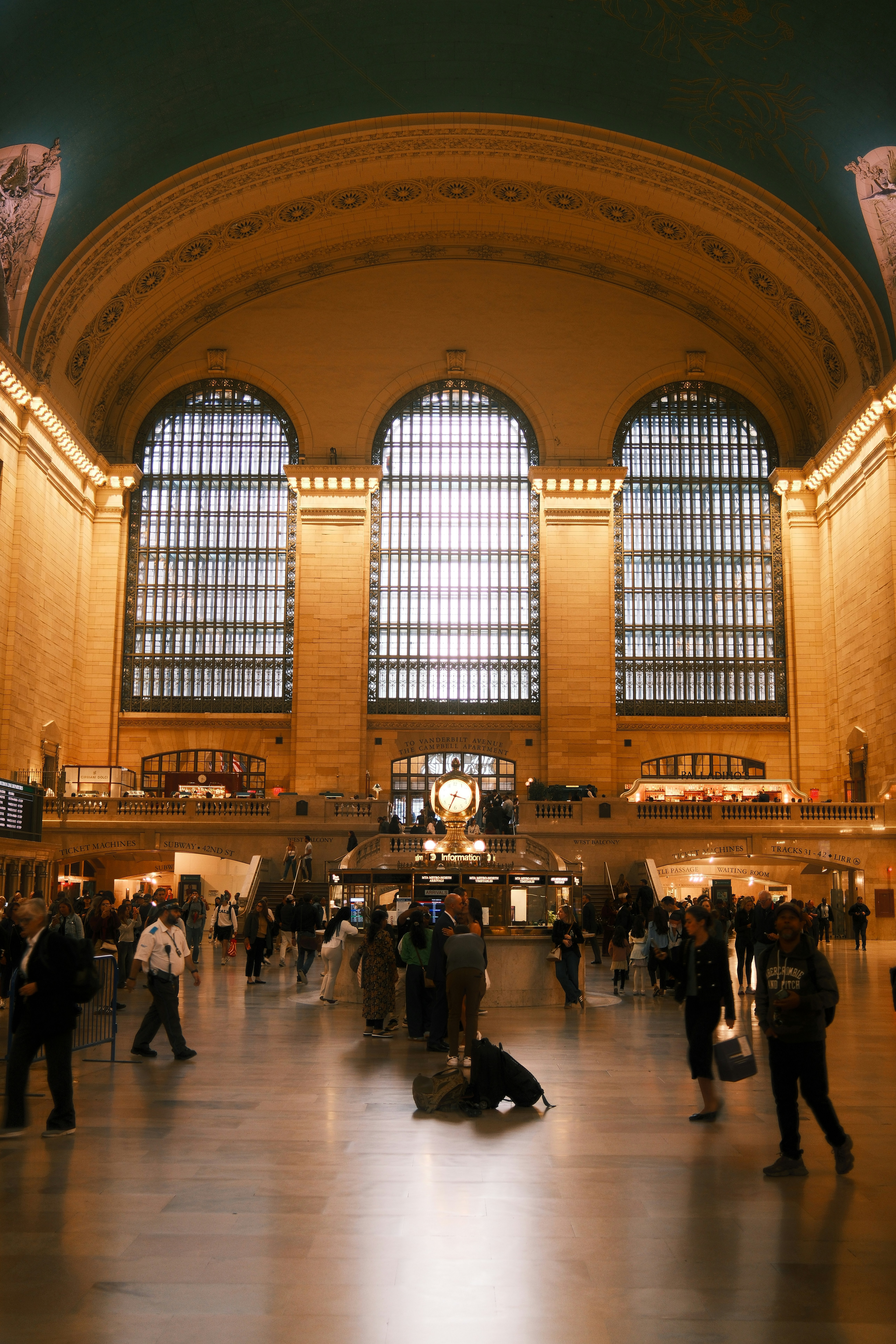 Grand Hall, Time-Worn Glass, and Quiet Travelers