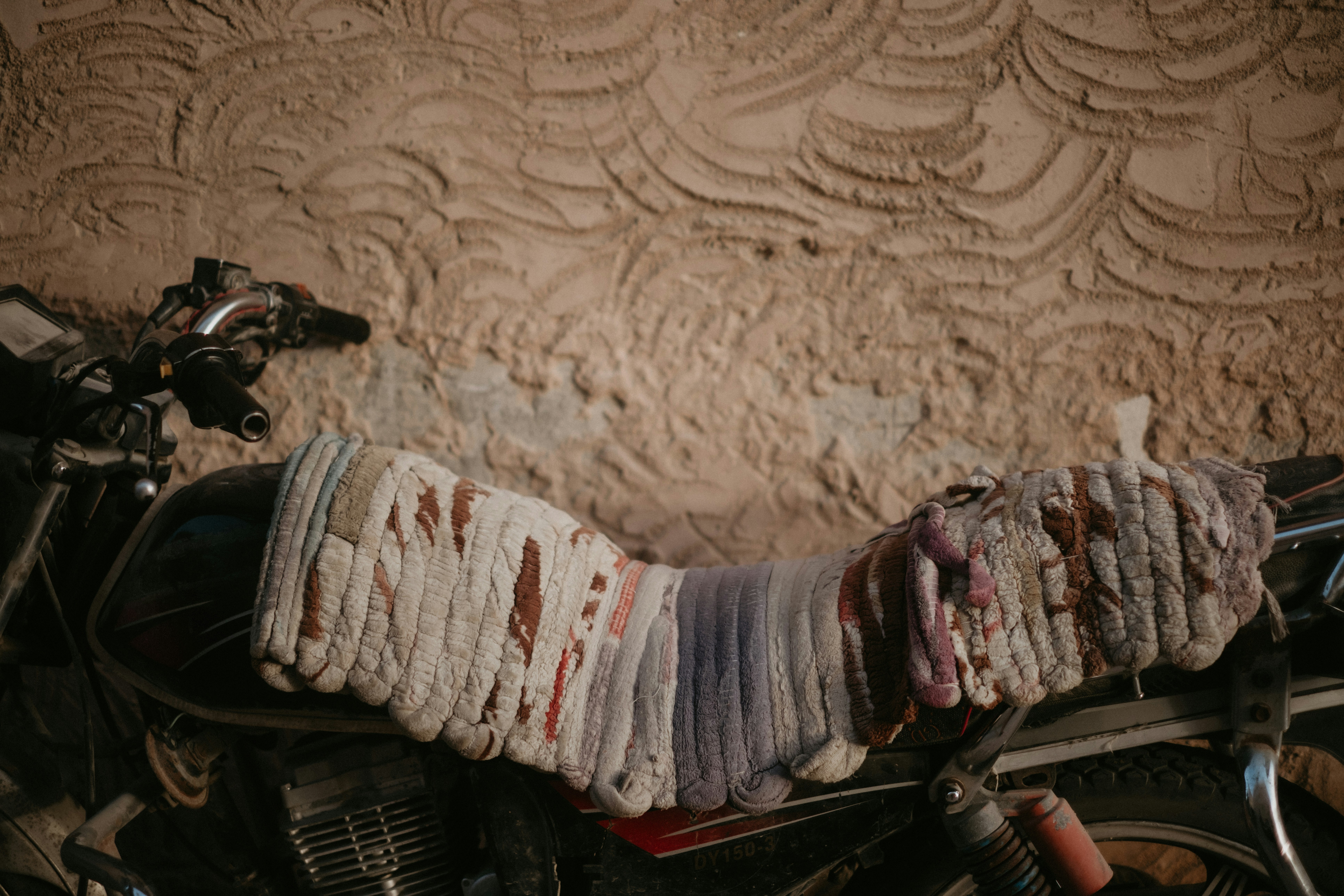 Hand-wrapped Saddle Stories on a Quiet Motorcycle