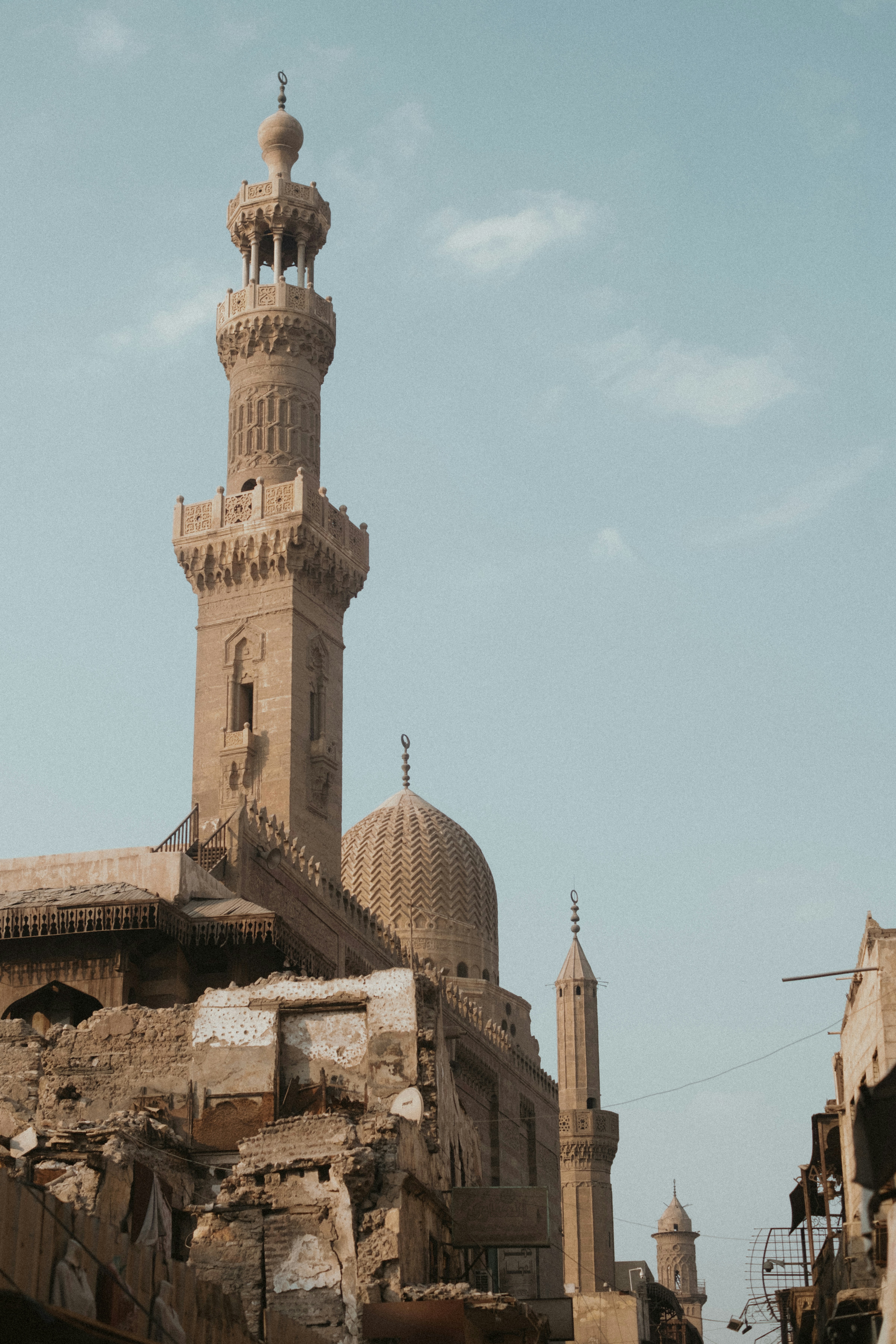 Desert Minaret Rising Above Rubble: A Timeworn Street Scene