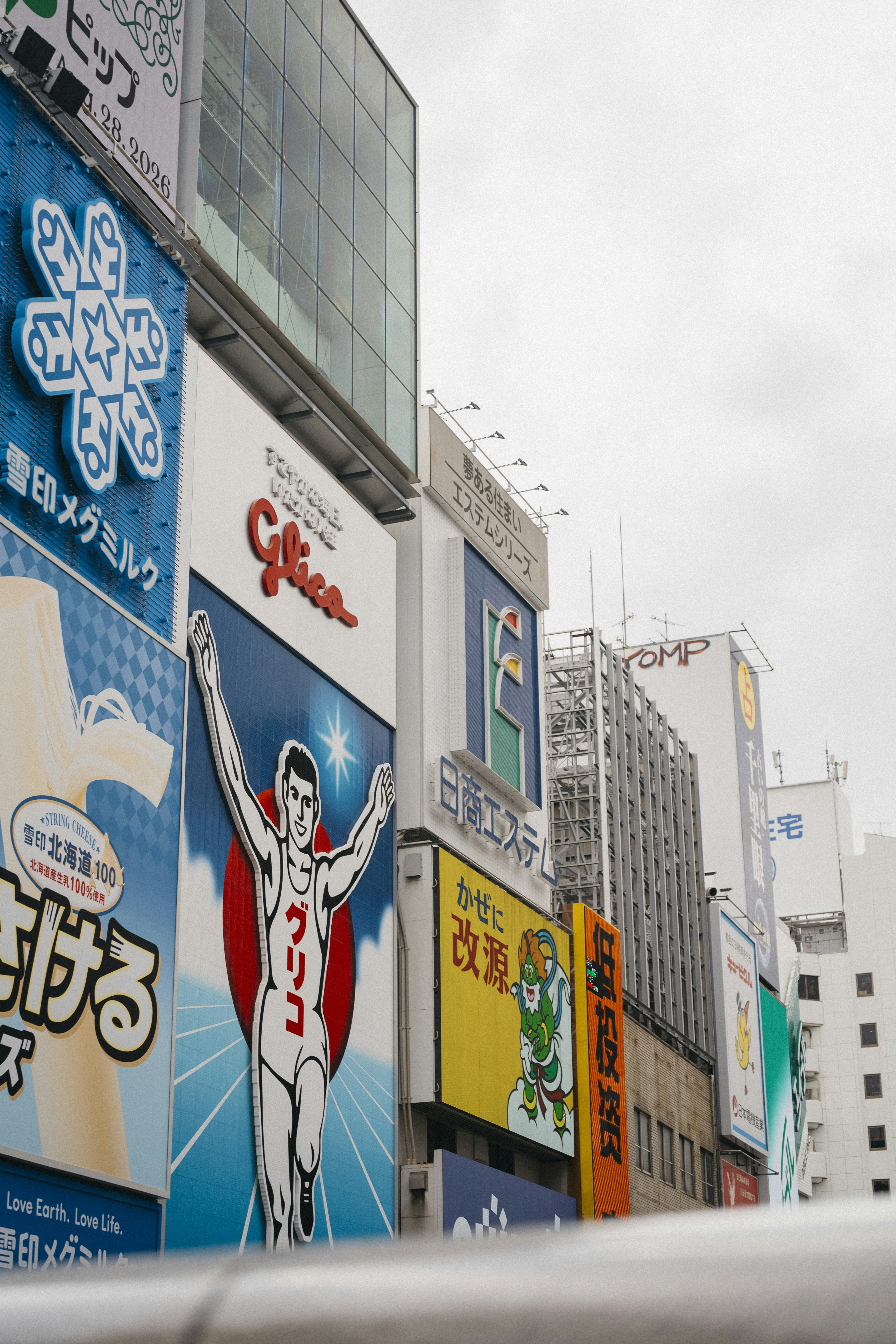 Cityscape Billboard Spotlight: A Tall Cascade of Signage and Character