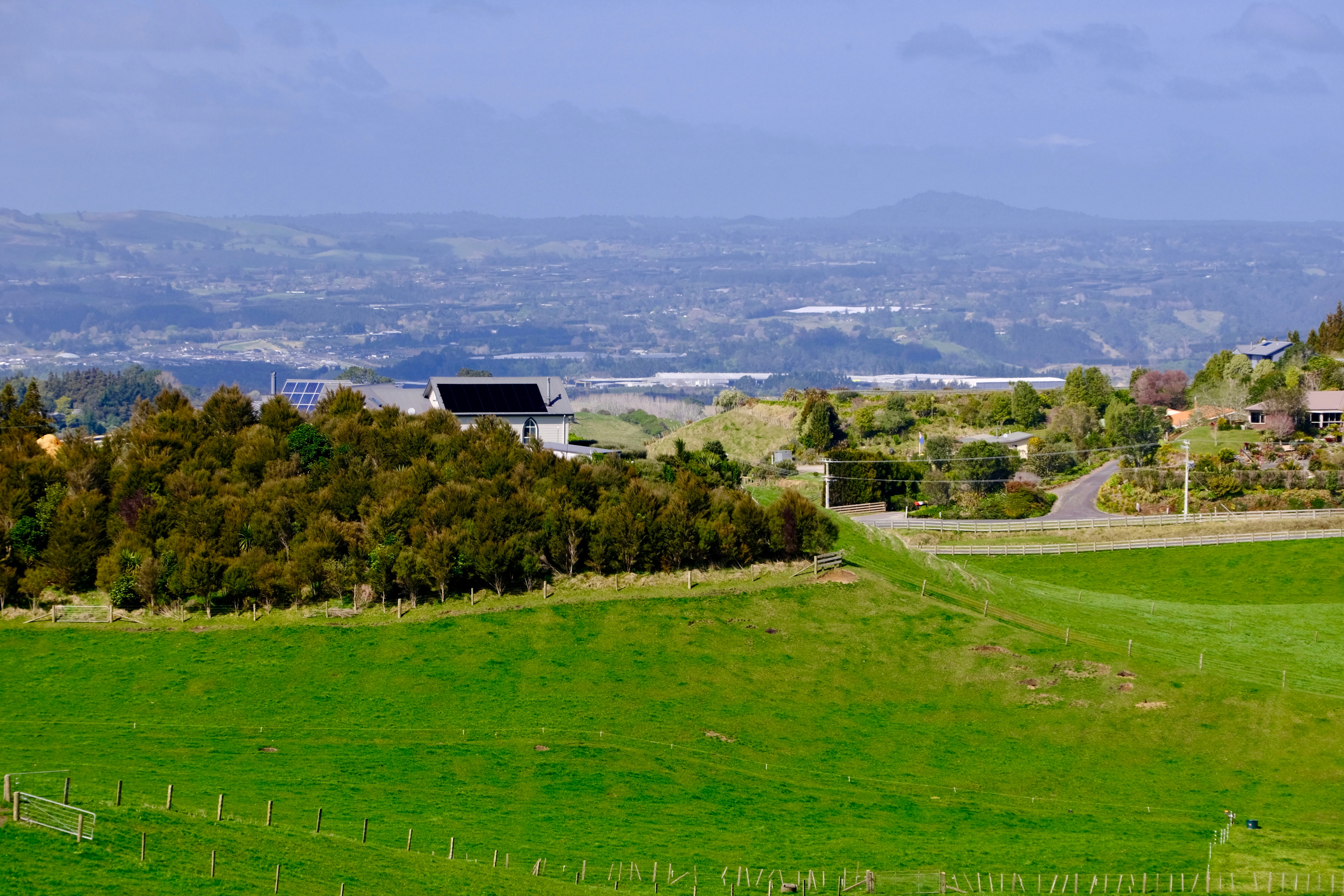 Pastoral Crest: A Quiet Valley Under a Wide Sky