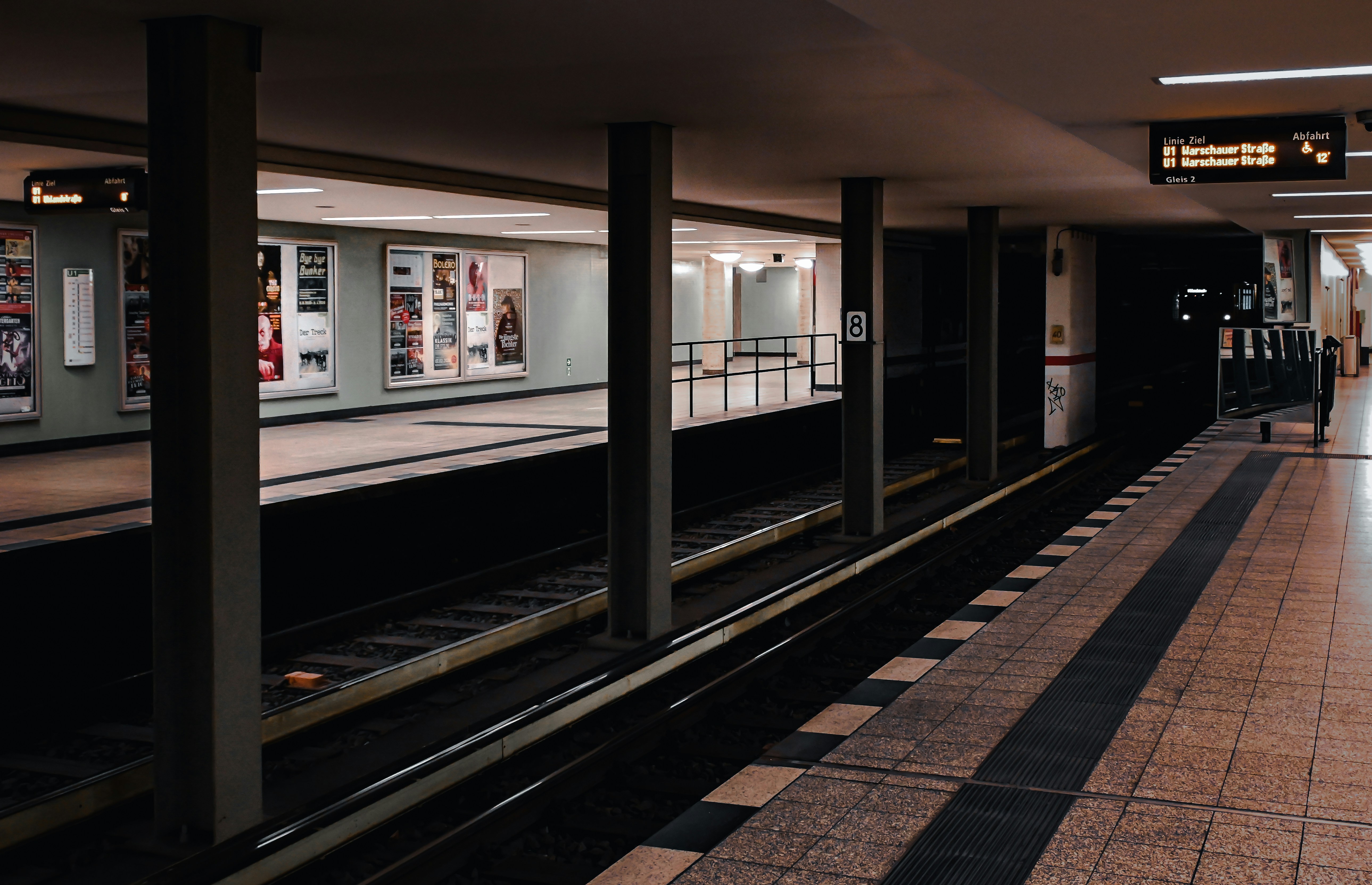 Quiet Platform at Dusk: A Subway Stop in Shadowed Light