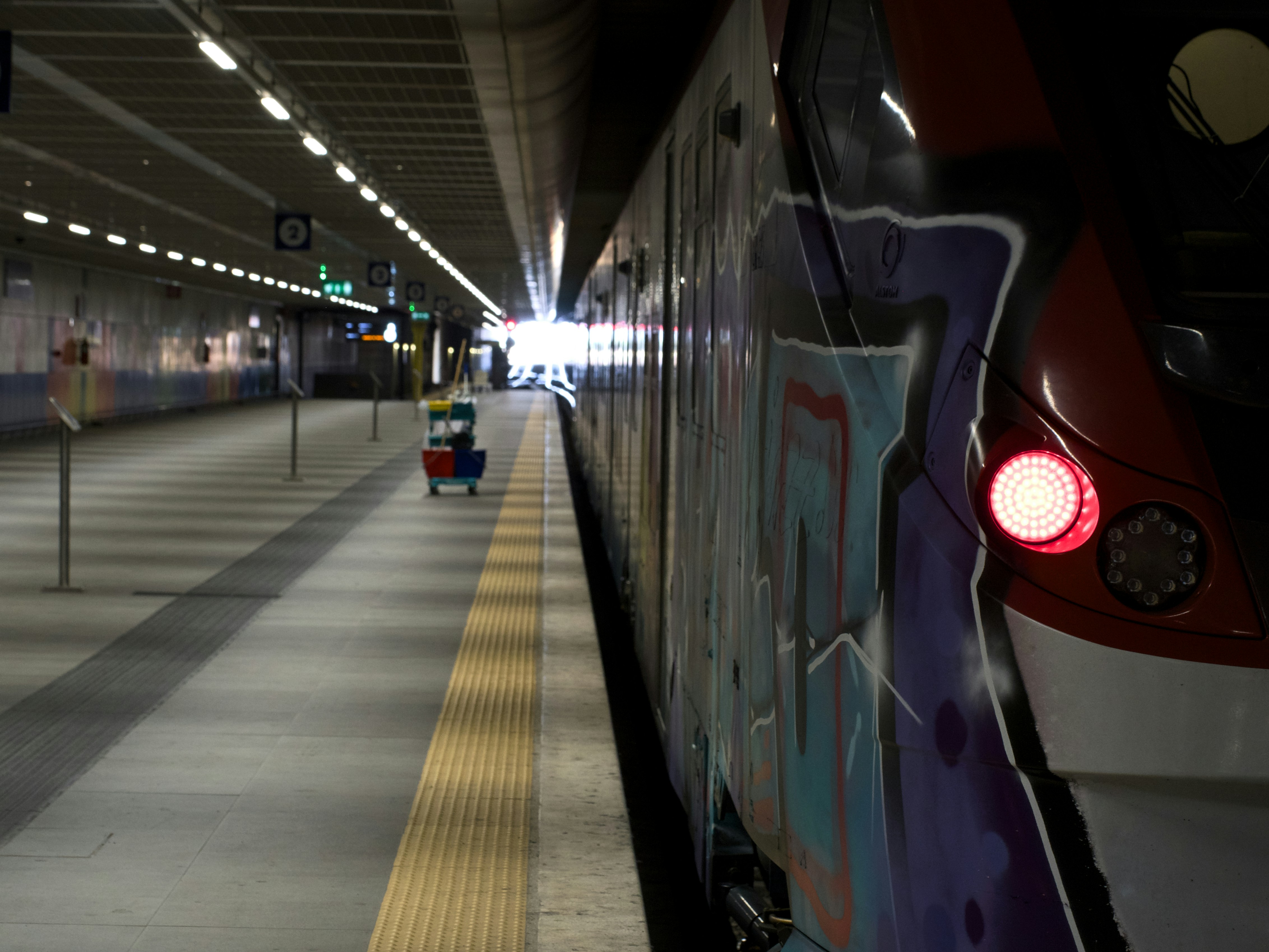 Graffitied Railcar at Distant Station