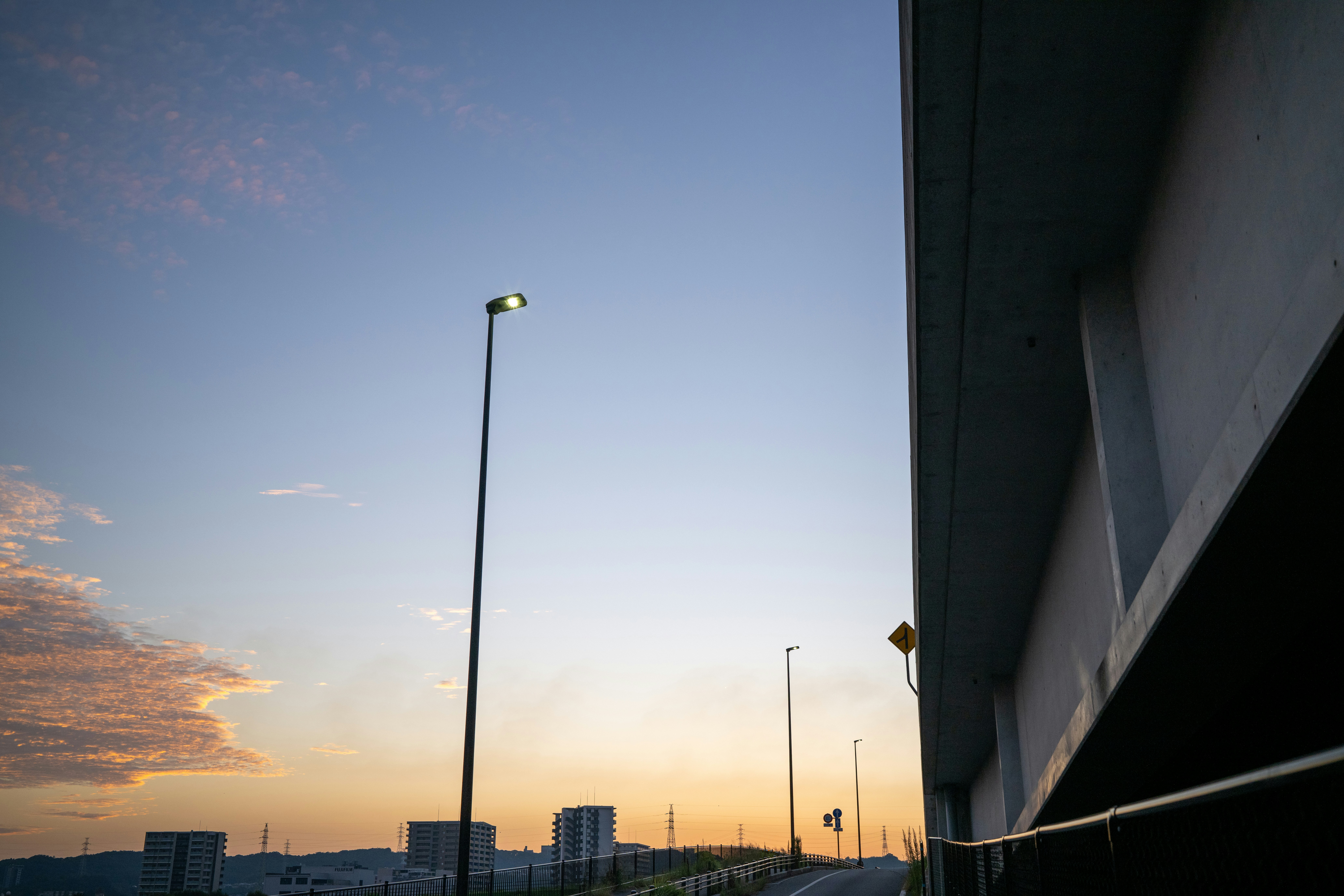 Sunset Over the City Edge by the Overpass