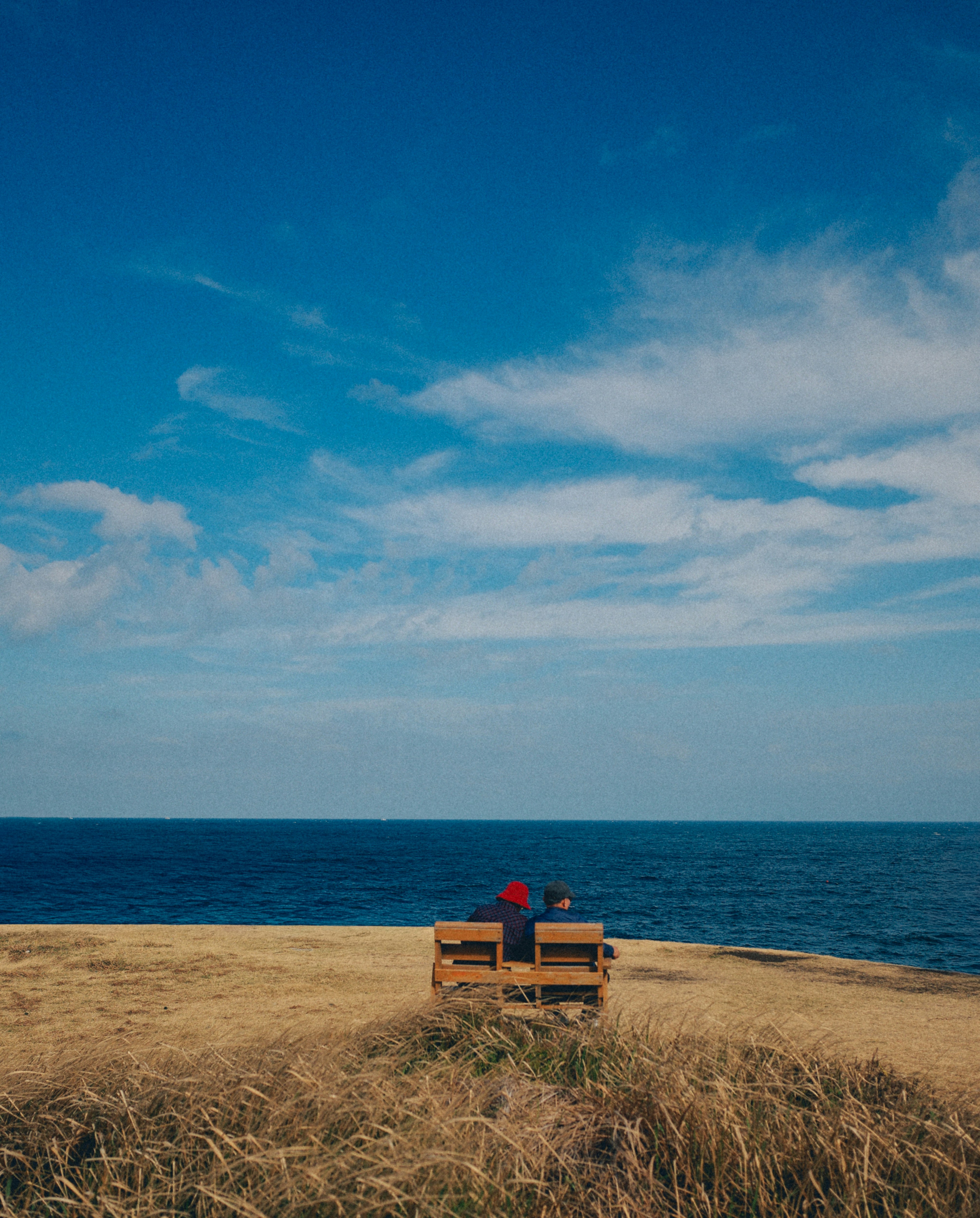 Two Heads on a Dune: Quiet Moment by the Sea