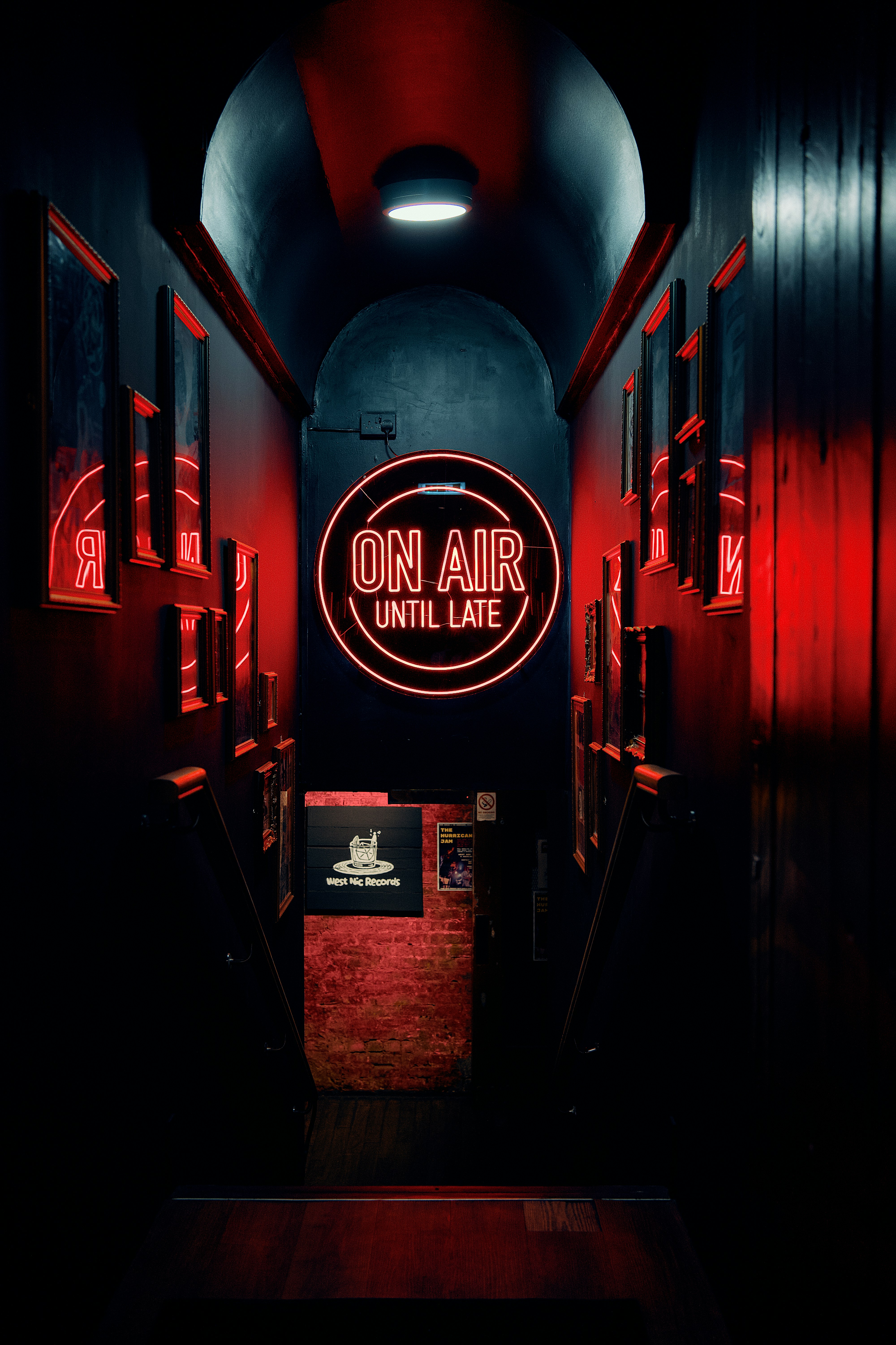 Neon Corridor: The Red Halo of an After-Hours Radio Room