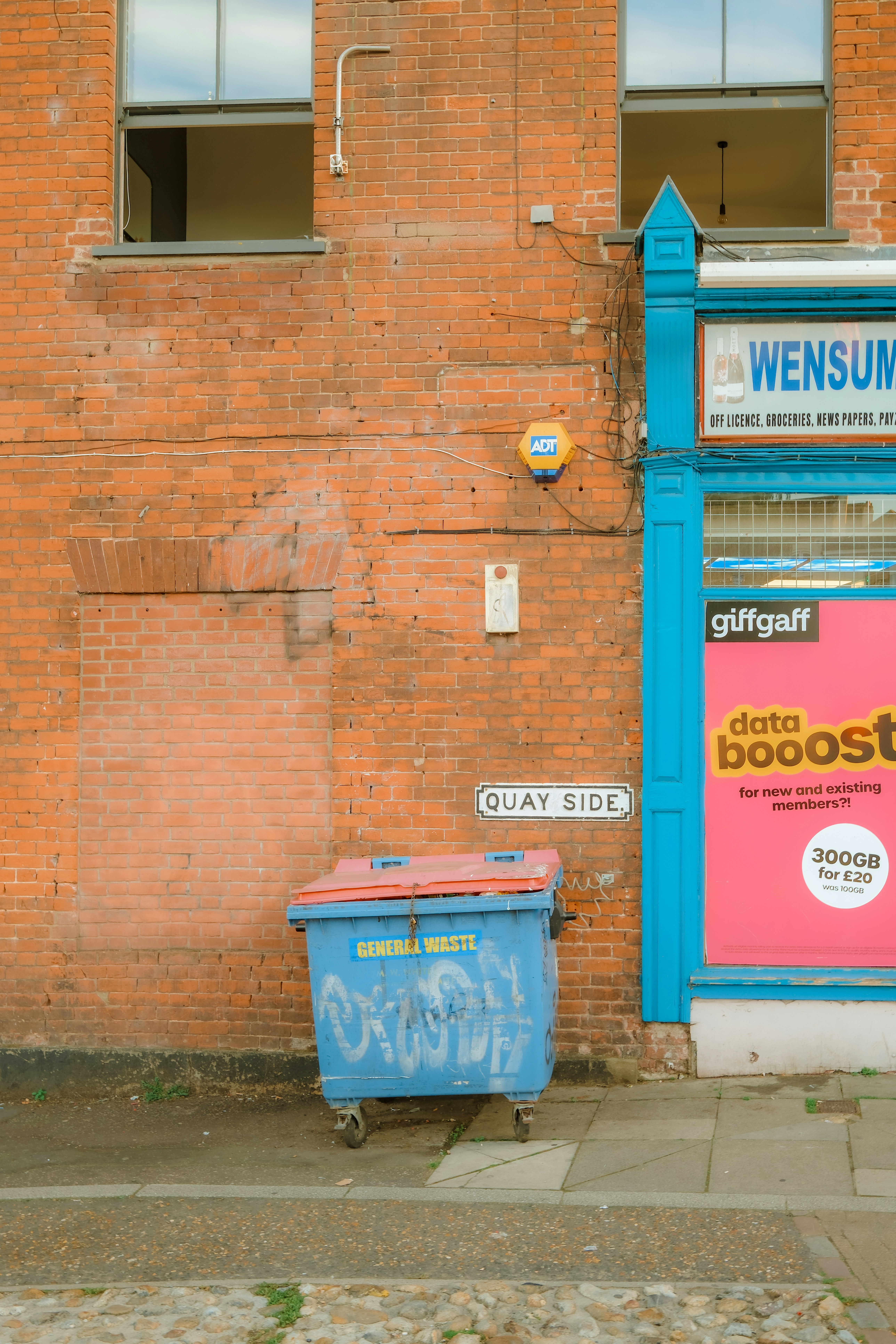 Brick-Blue Threshold: A Corner of the Town's Quiet Pulse
