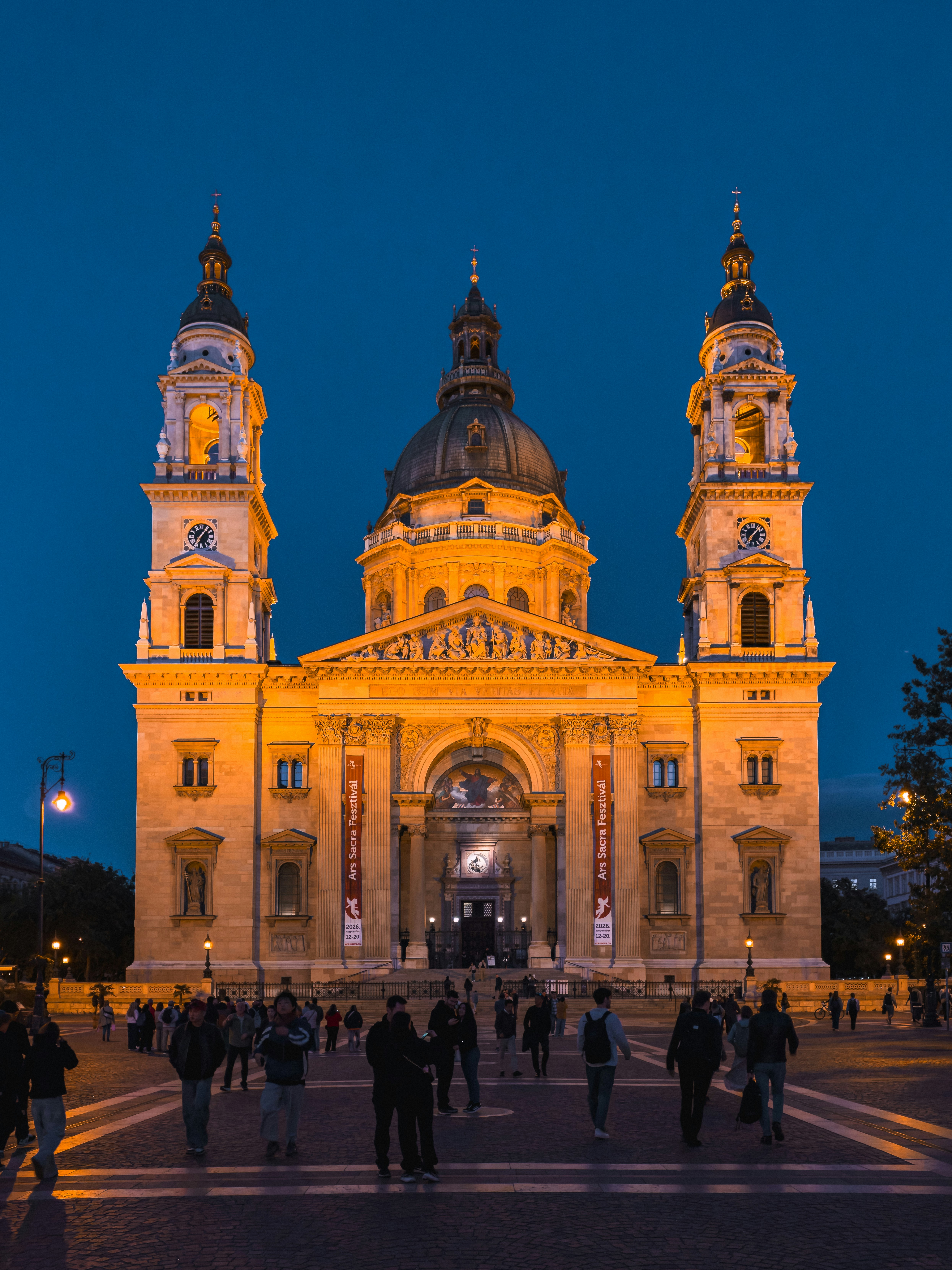 Golden Cathedral at Dusk: Grand Facade Bathed in Street Lantern Light