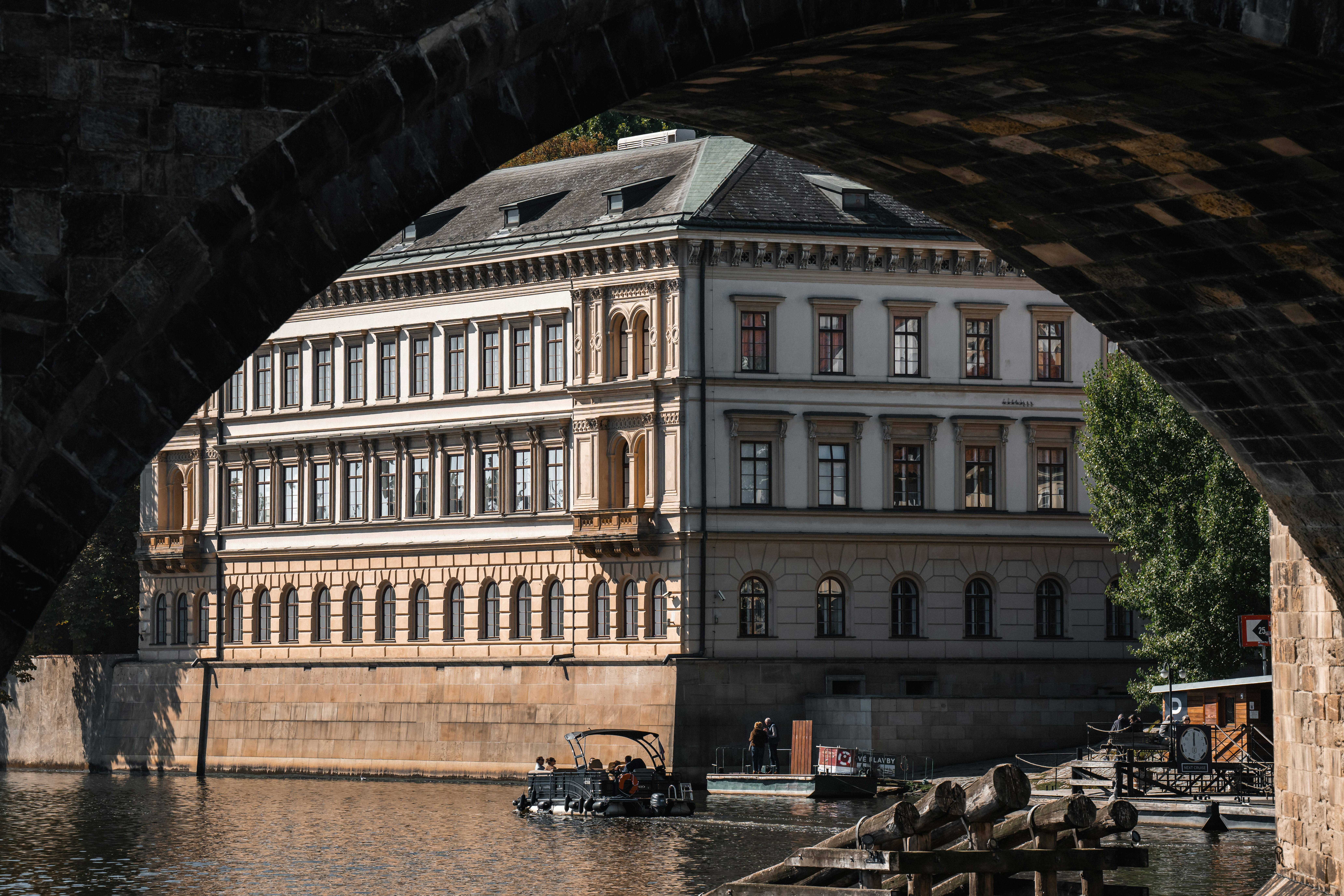 Under the Arch, by the River: A Historic Stamford Facade Framed in Shadow