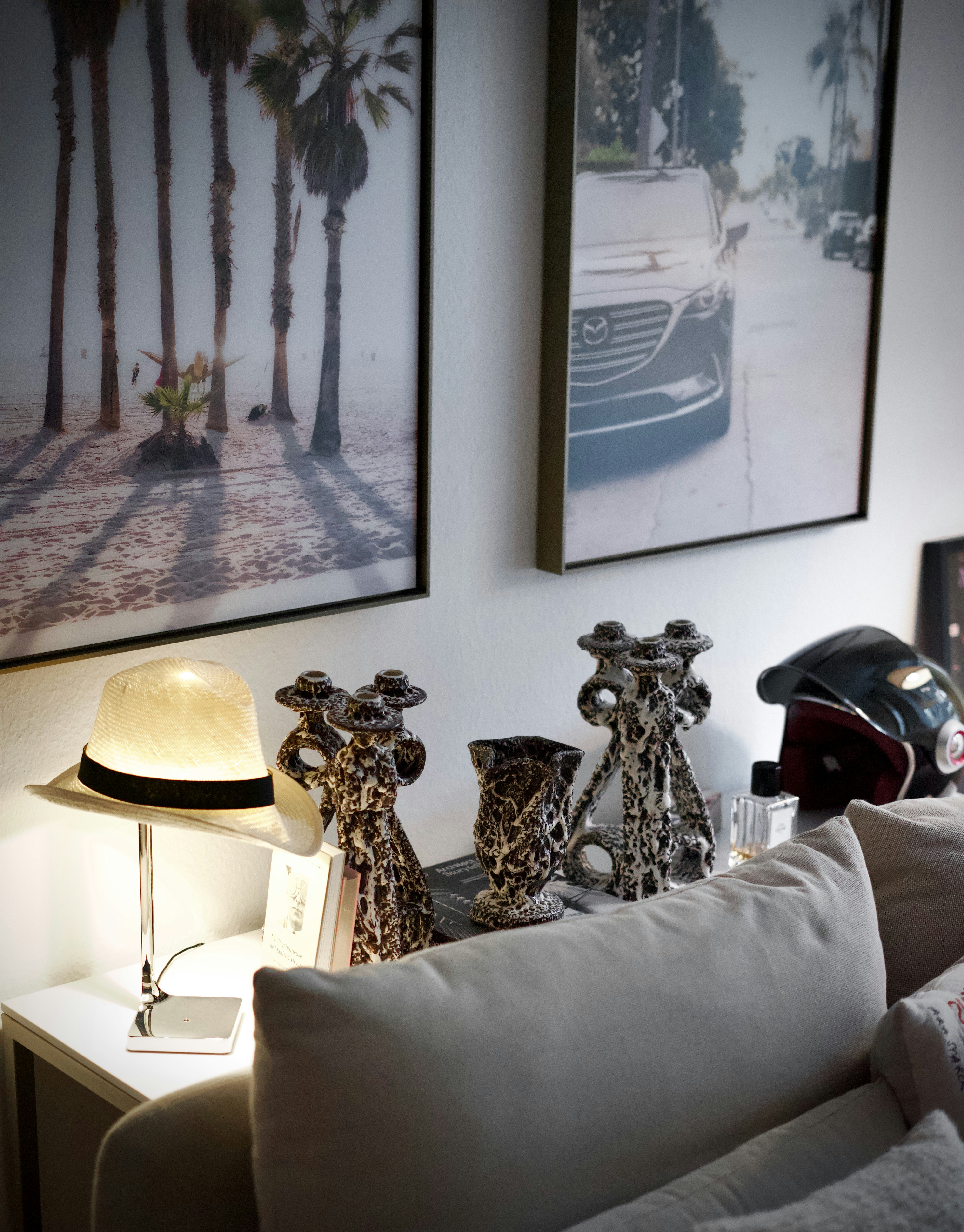 Palm-Print Gallery: A Cozy Nightstand Scene with Framed Travel Murals