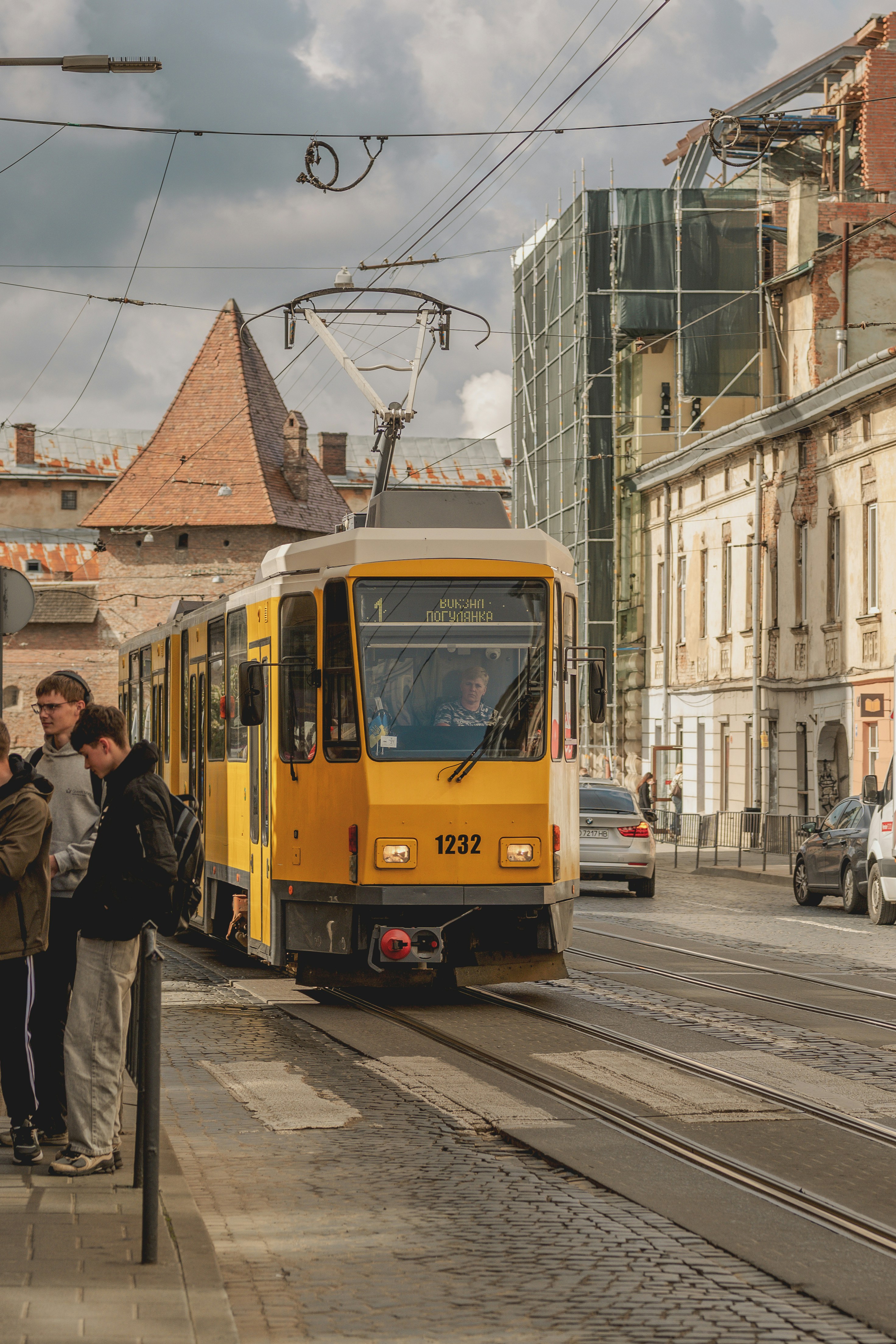 Yellow Metro at the Edge of a Historic Street