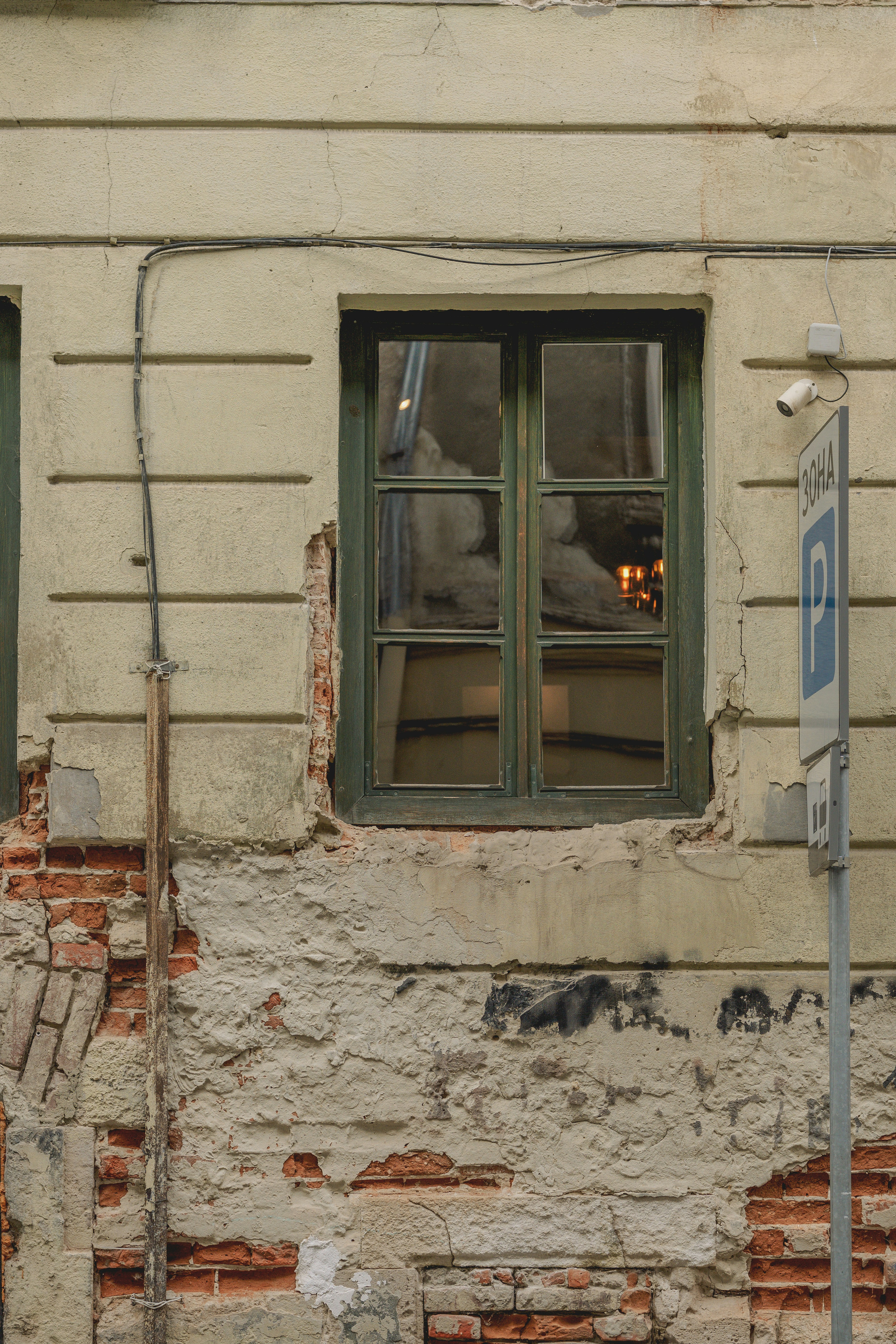 Broken Wall, Framed Window: A Quiet Urban Moment