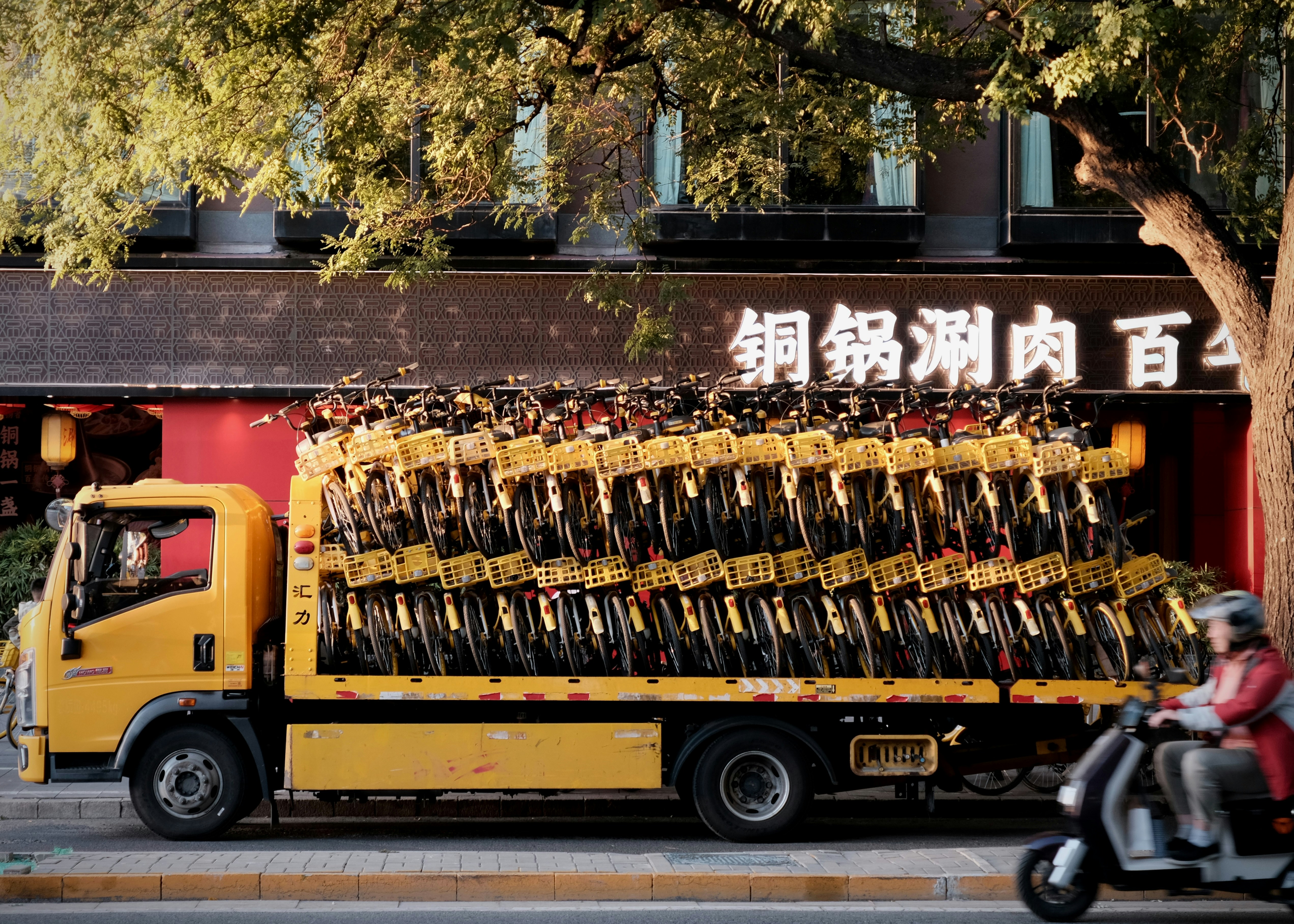 Yellow Cargo of Chairs: A City Street Snapshot