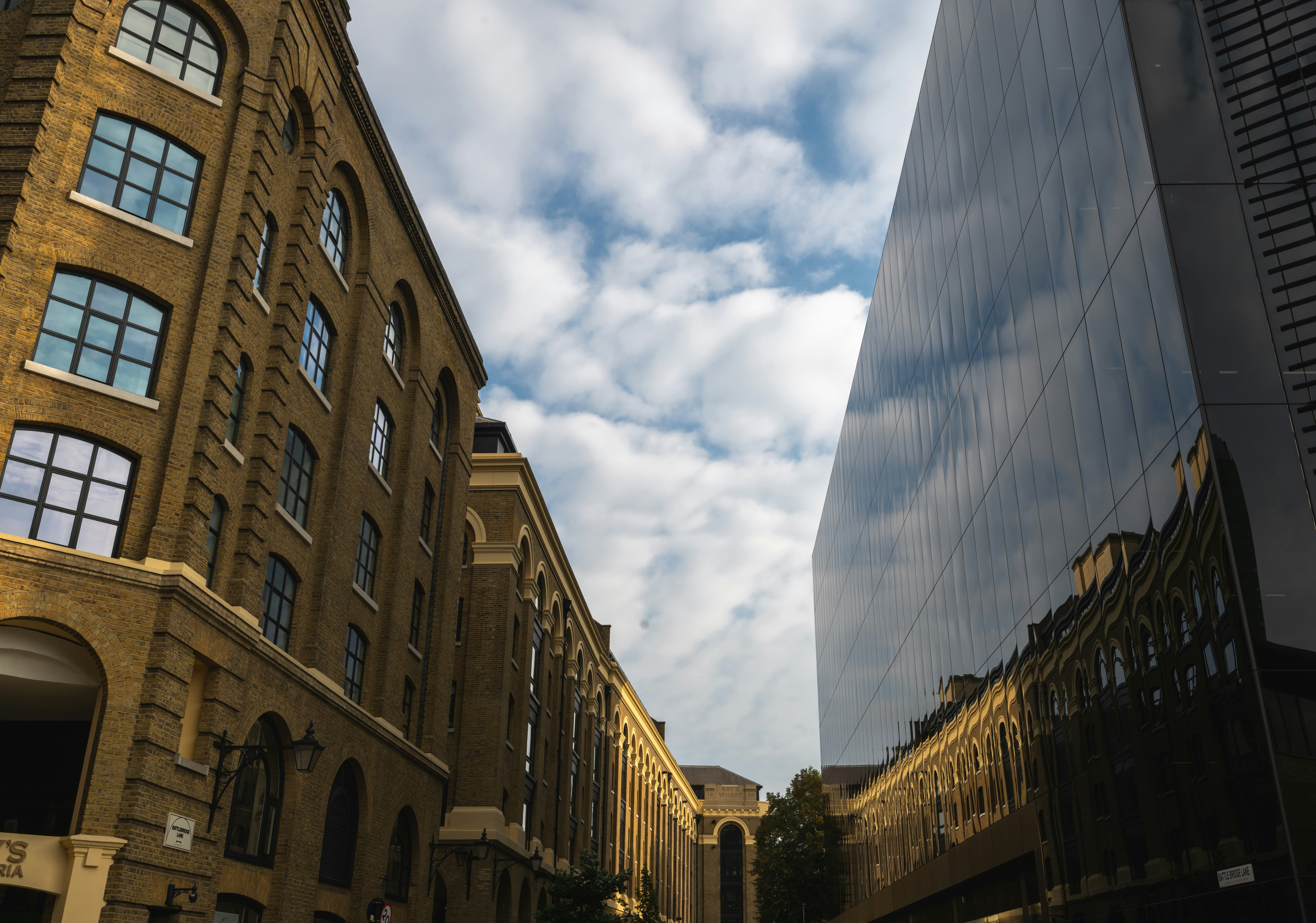 City Glass and Brick: A Street Between Two Facades