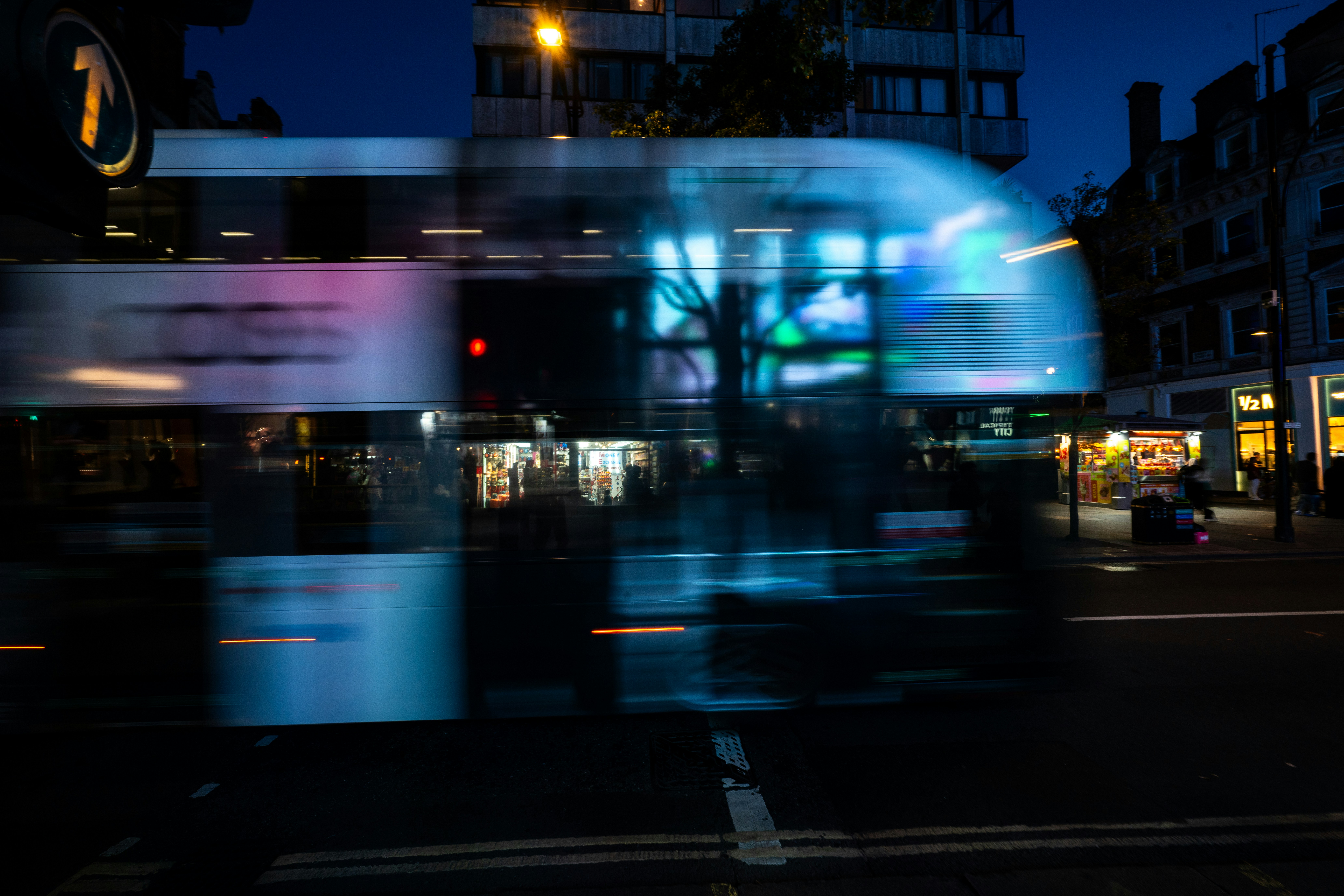 Blue Motion Through Night Streets: A Blur of City Transit