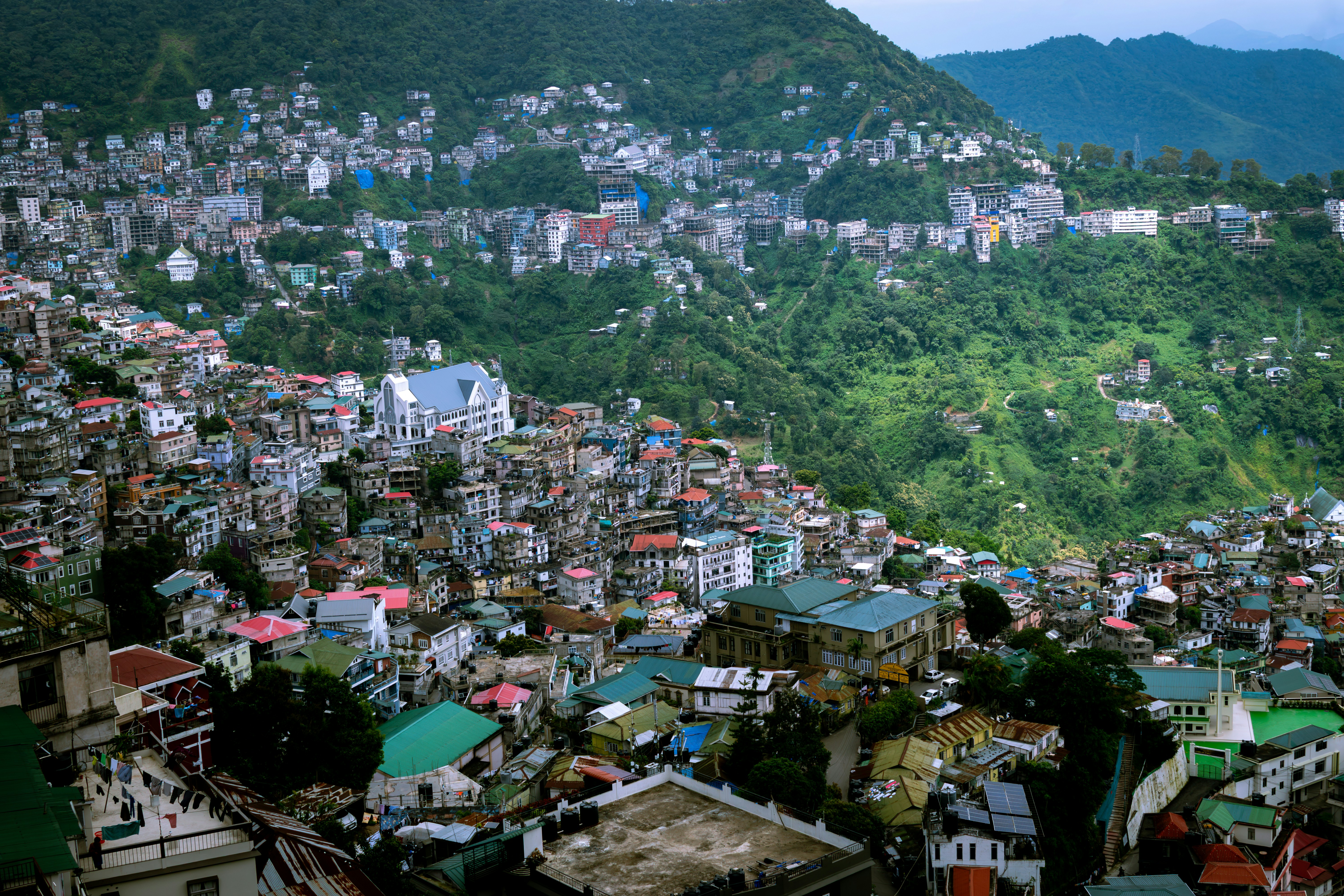 Terraced Chaos: A Portrait of a Mountain Town Nestled in Green Rorges