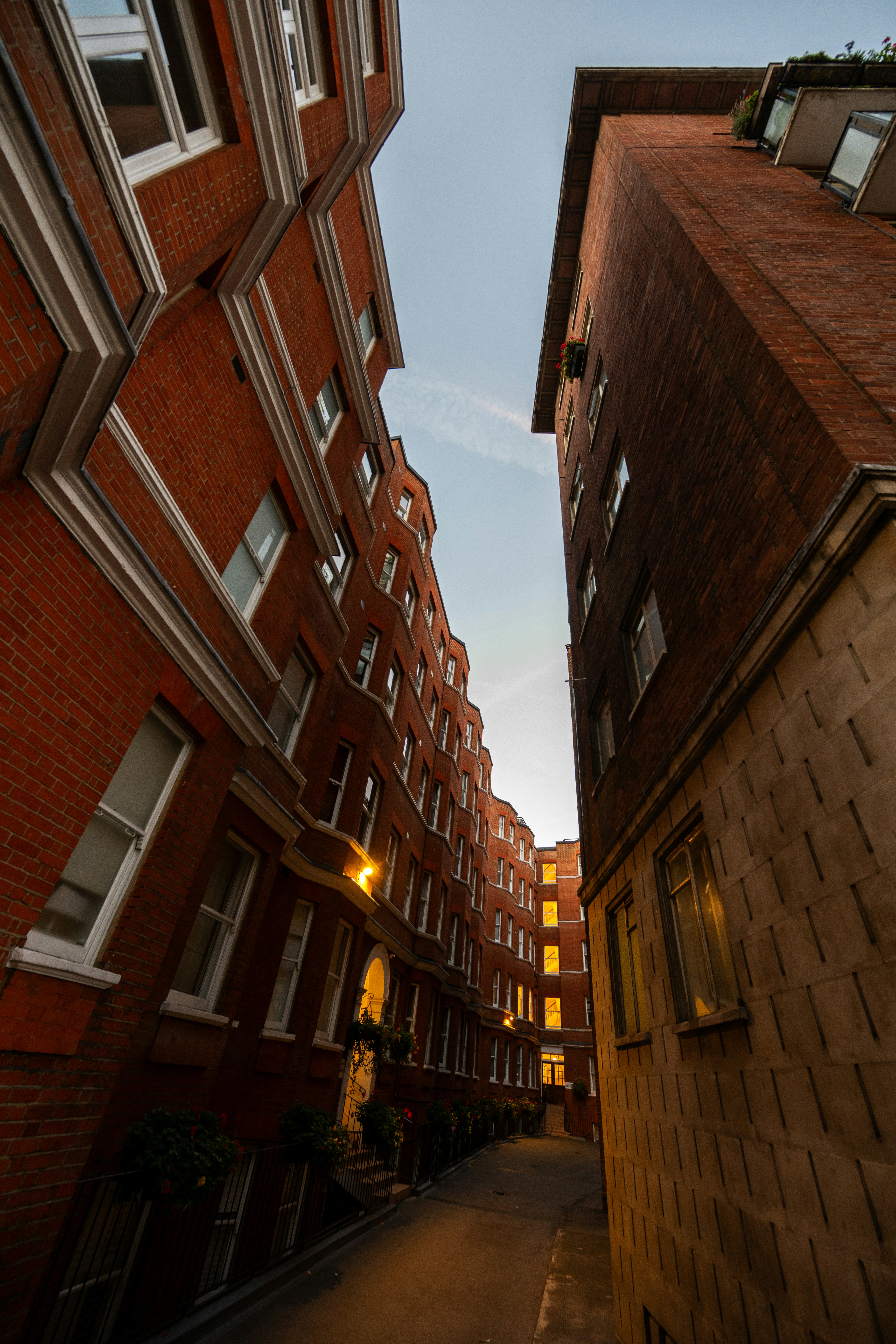 Copper Canyon: A Narrow Brick Alley Between Towers at Dusk