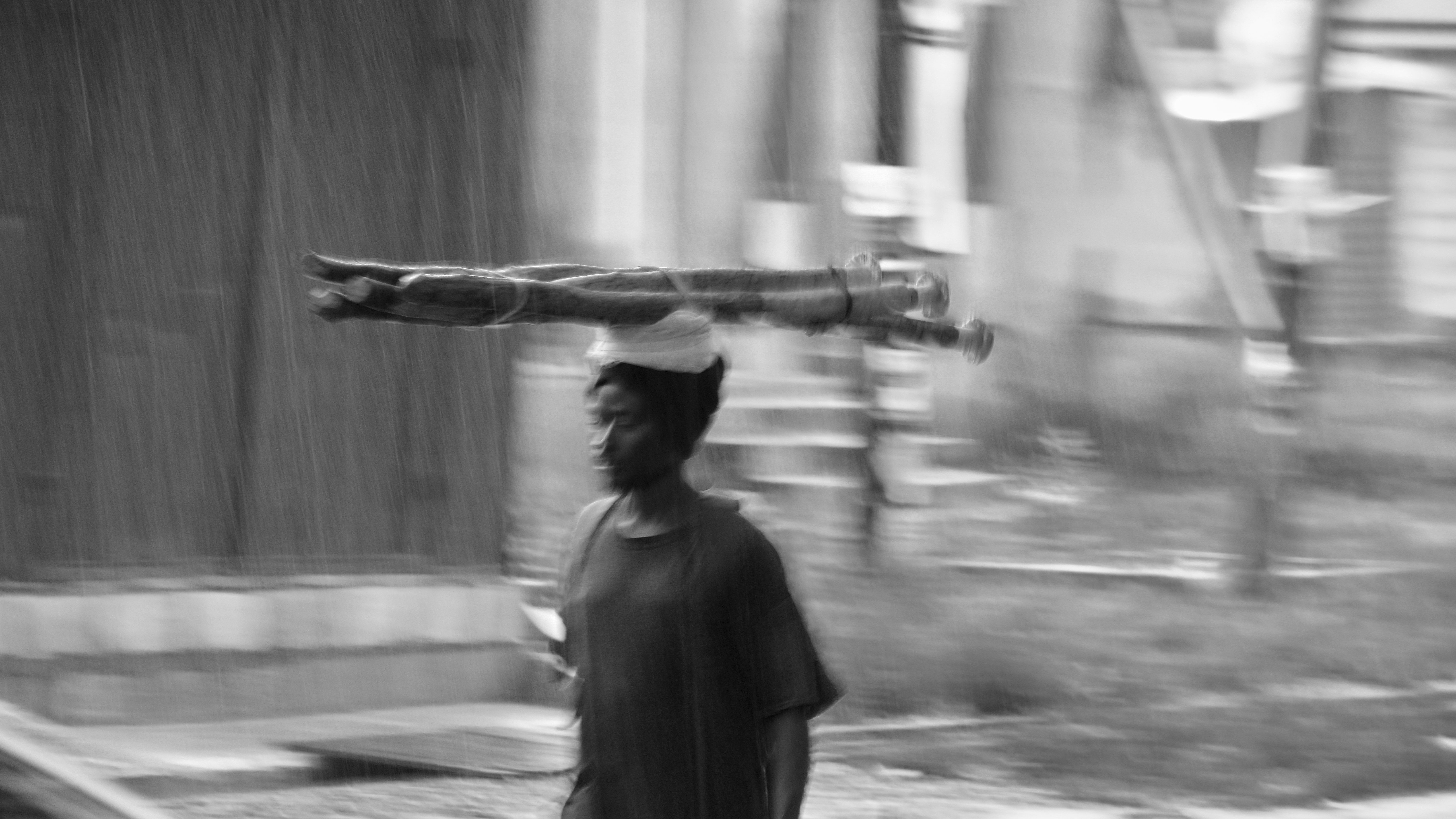 Umbrella of Resolve: A Street Moment in Monochrome
