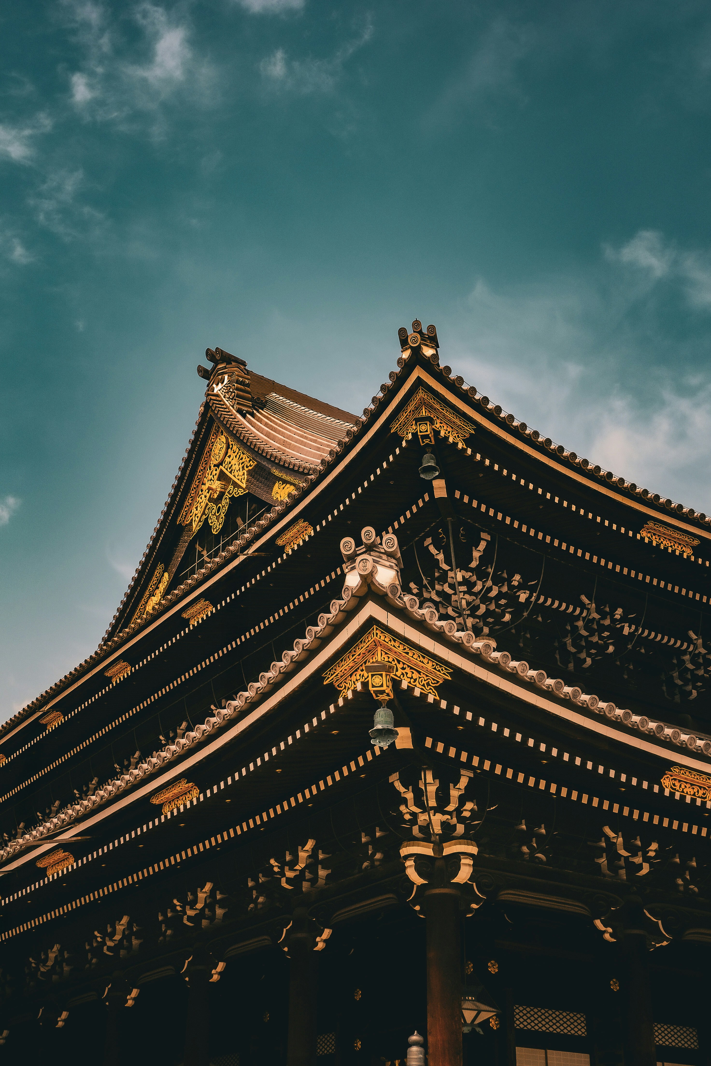 Temple Eaves: Golden Ornamentation Framing a Sky Patch