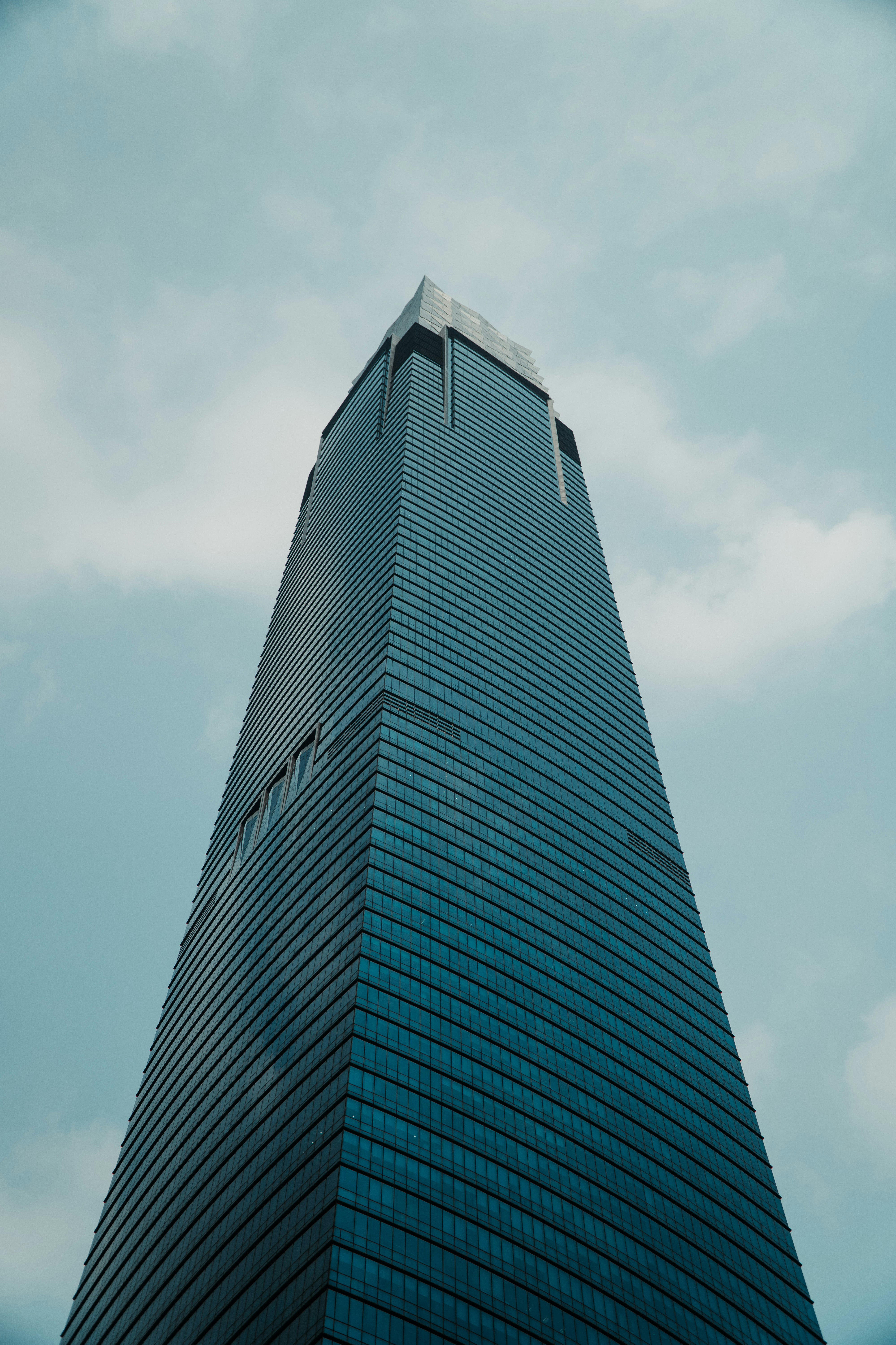 Skyward Monolith: A Corporate Spire Piercing the Blue