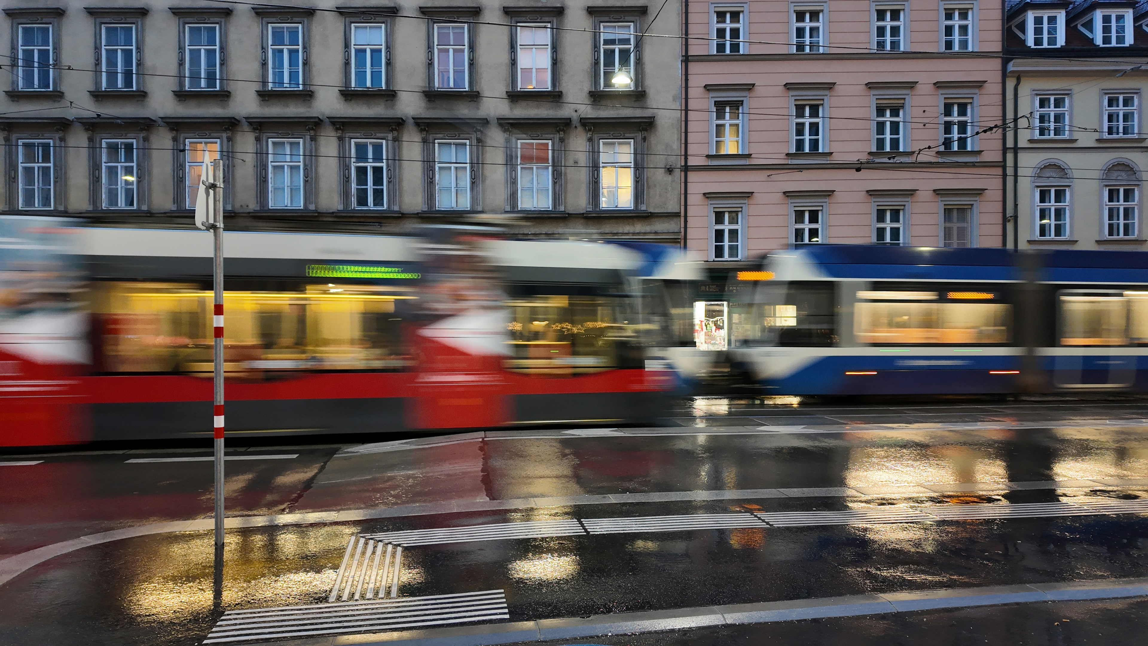 Blurry Tram Blues: A Wet City Ride in Motion