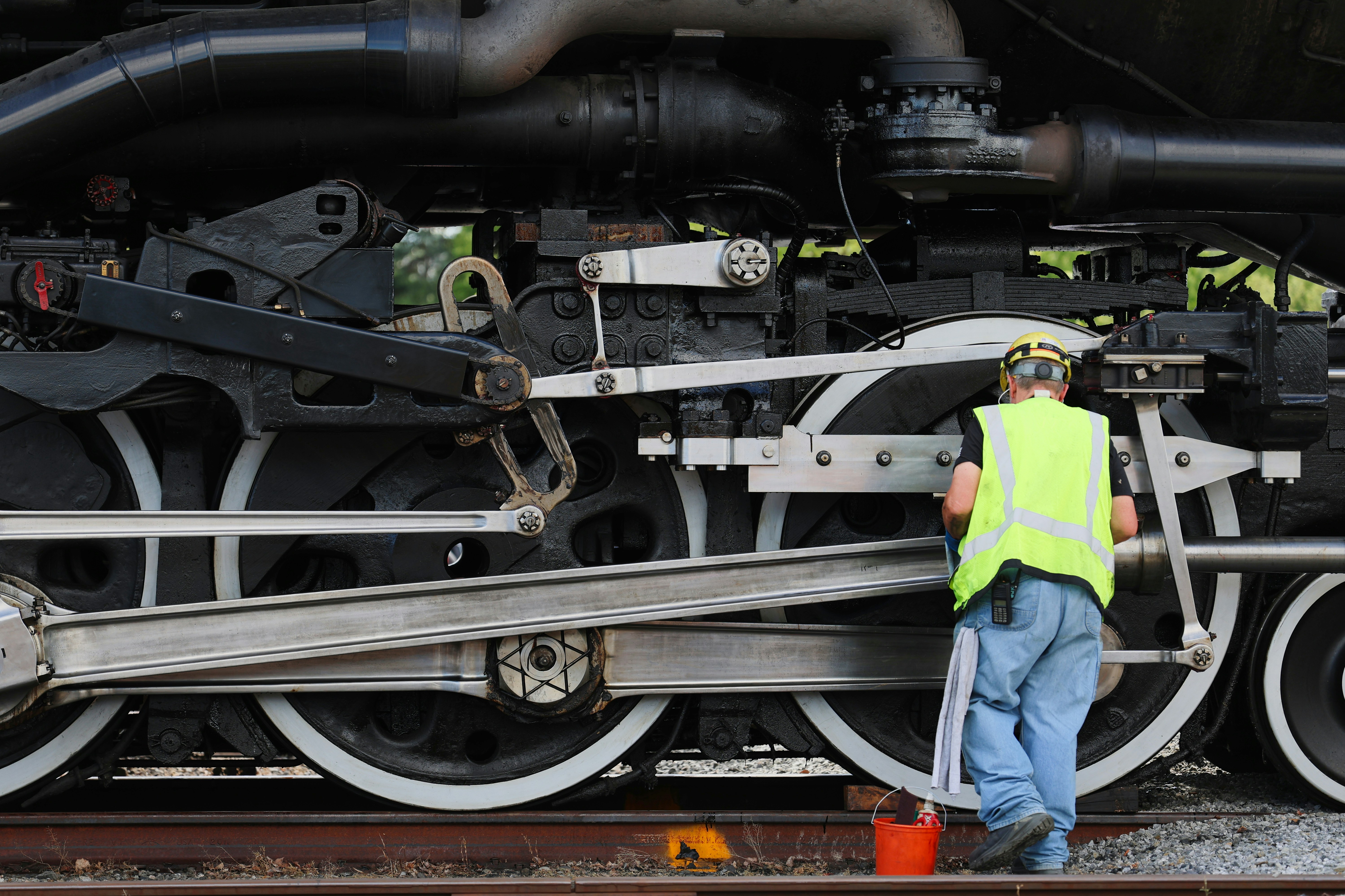 Steam Engine in Motion: Maintenance Worker at the Valves