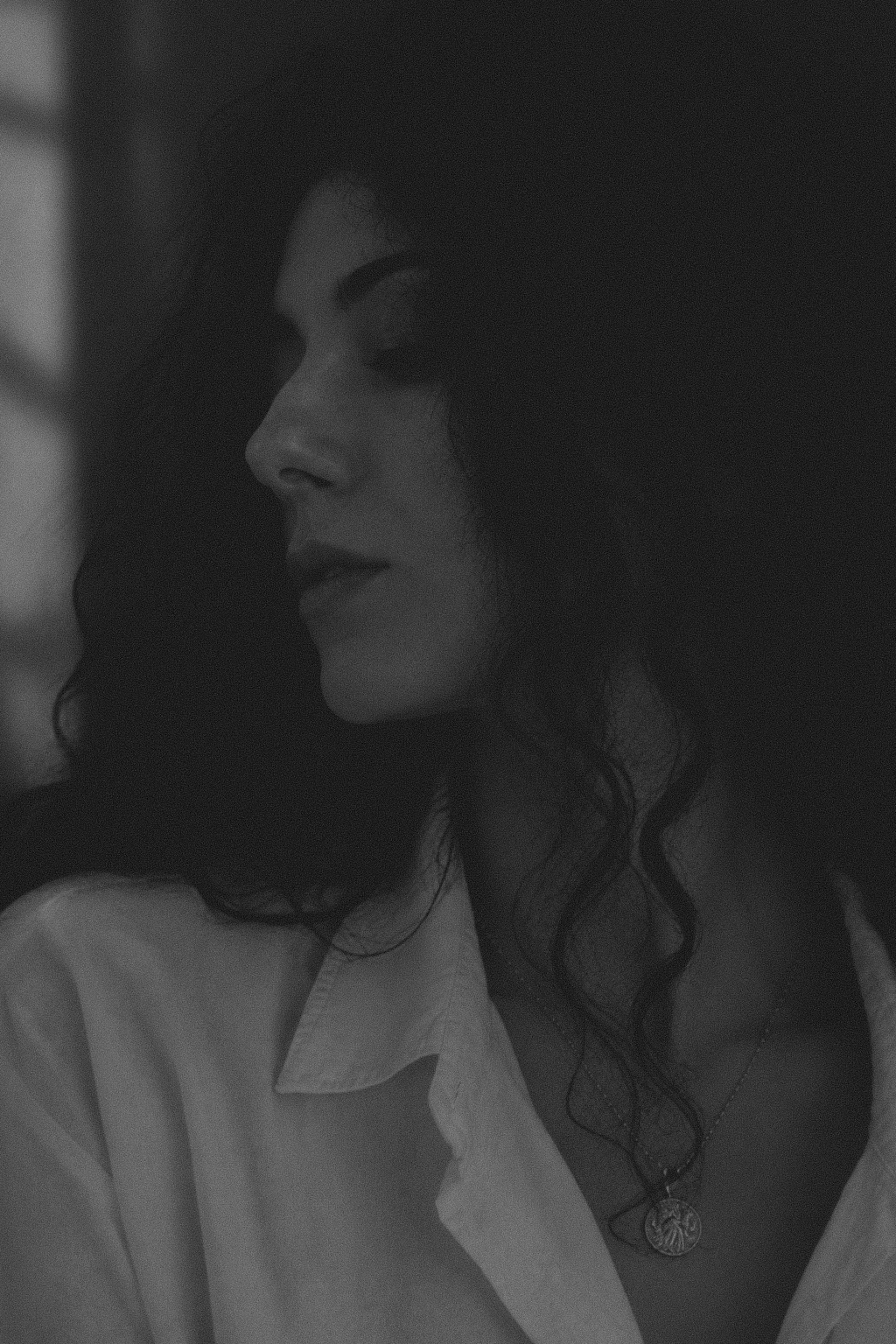 Quiet Contemplation: A Side Portrait in Soft Noir