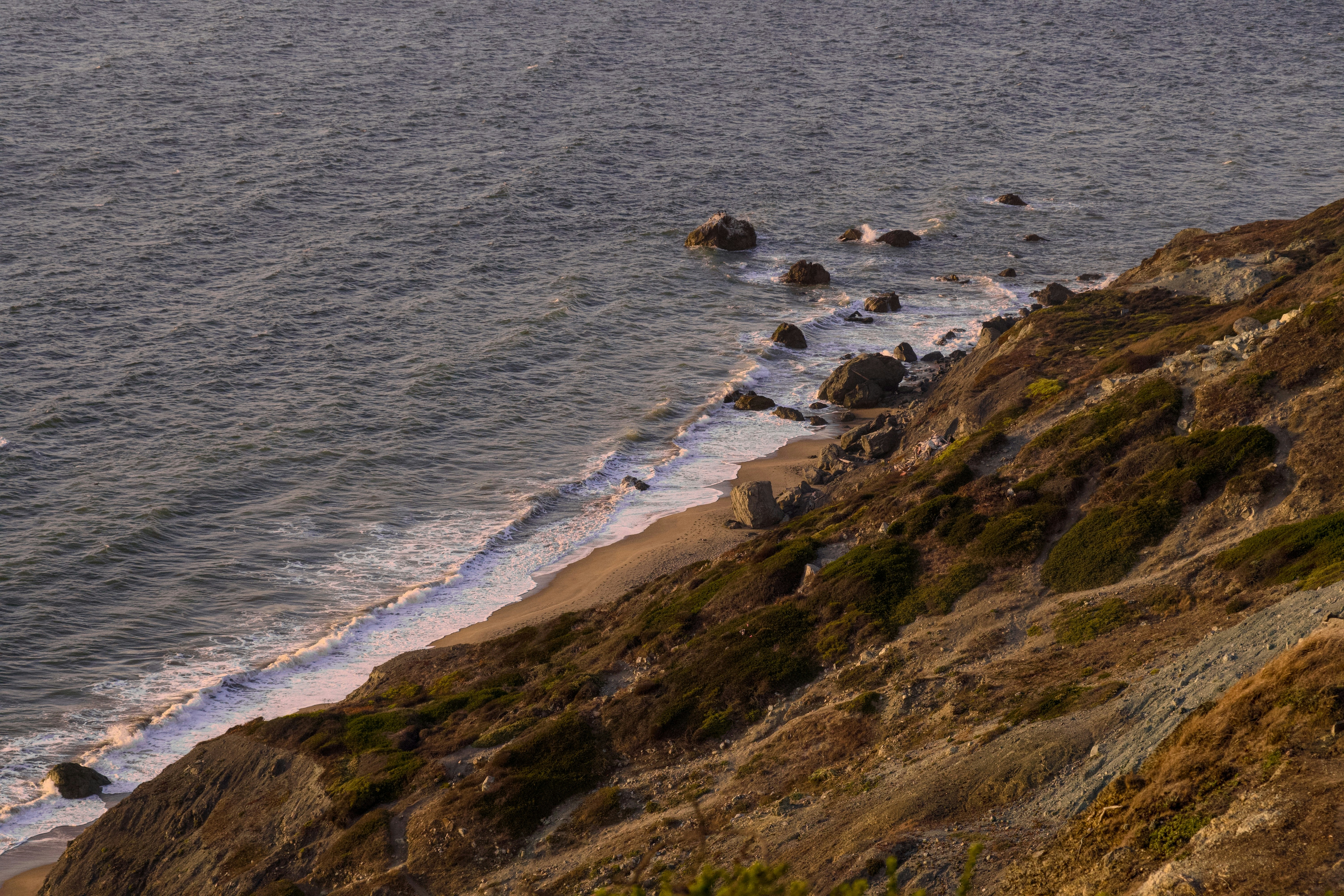 Cliffside Contemplation: Golden Hour Over the Cove