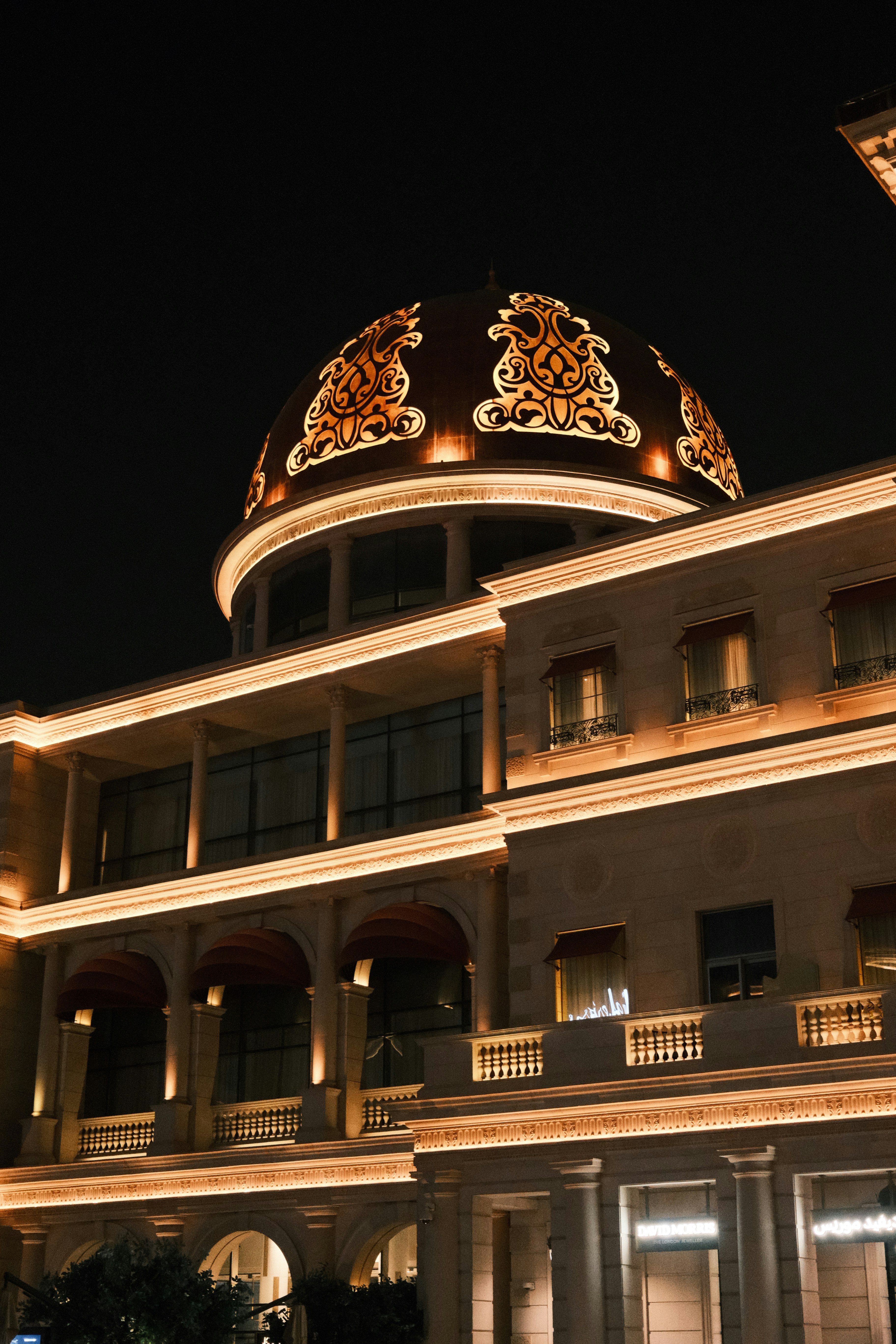 Night at the Dome: Golden Ornamentation Crowned over Classical Facade