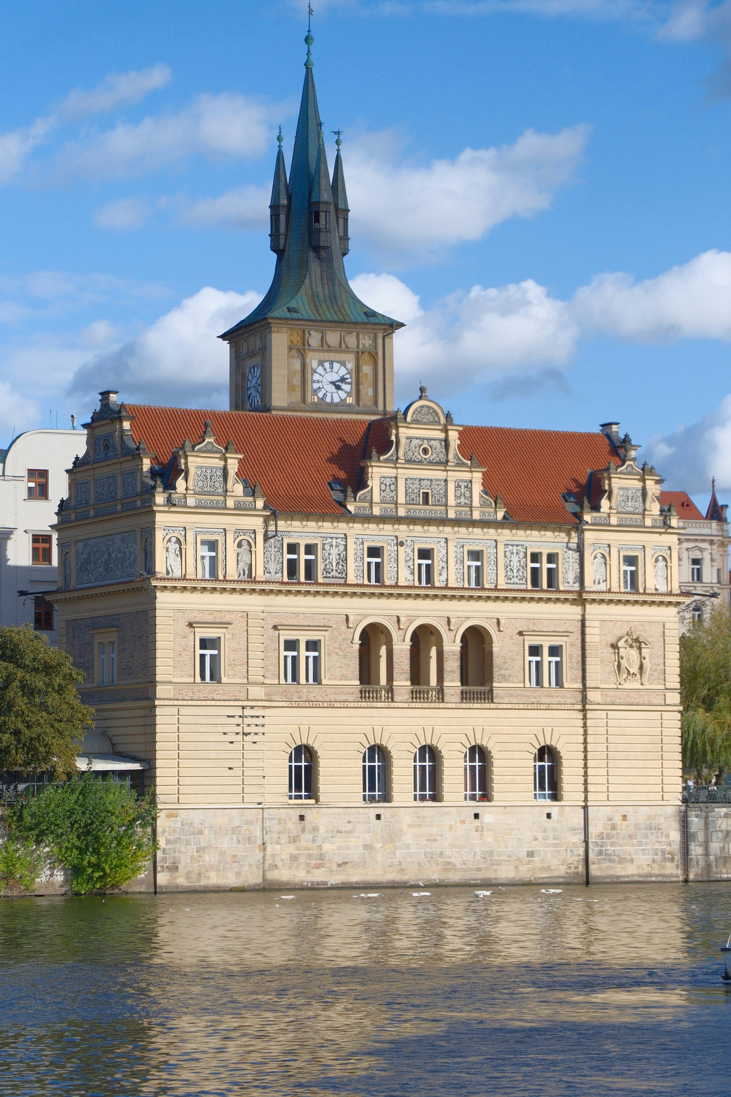 Riverside Town Hall with Clock Tower Rising over the Vltava