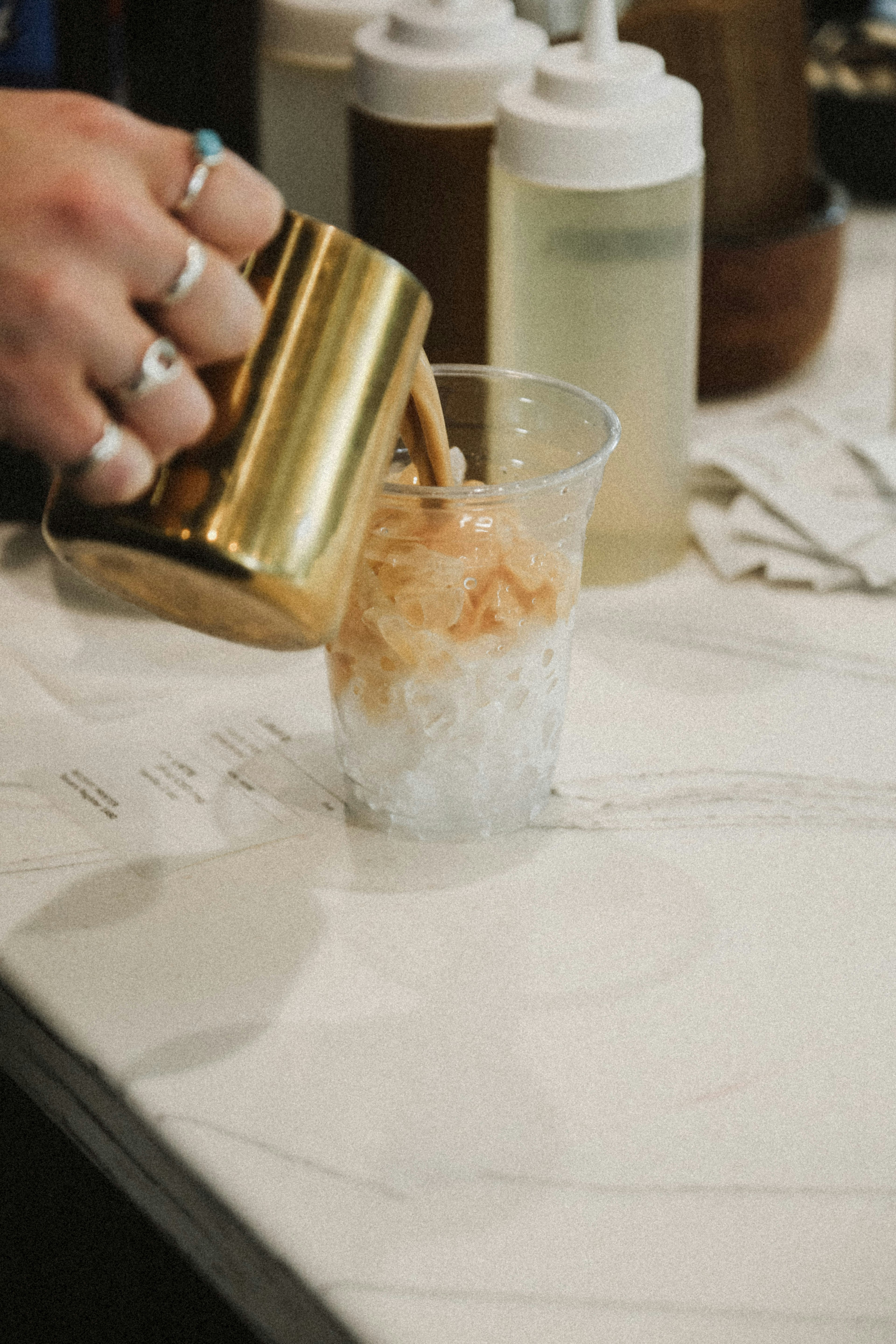 Golden Pour: Crafting Espresso Foam in a Glass