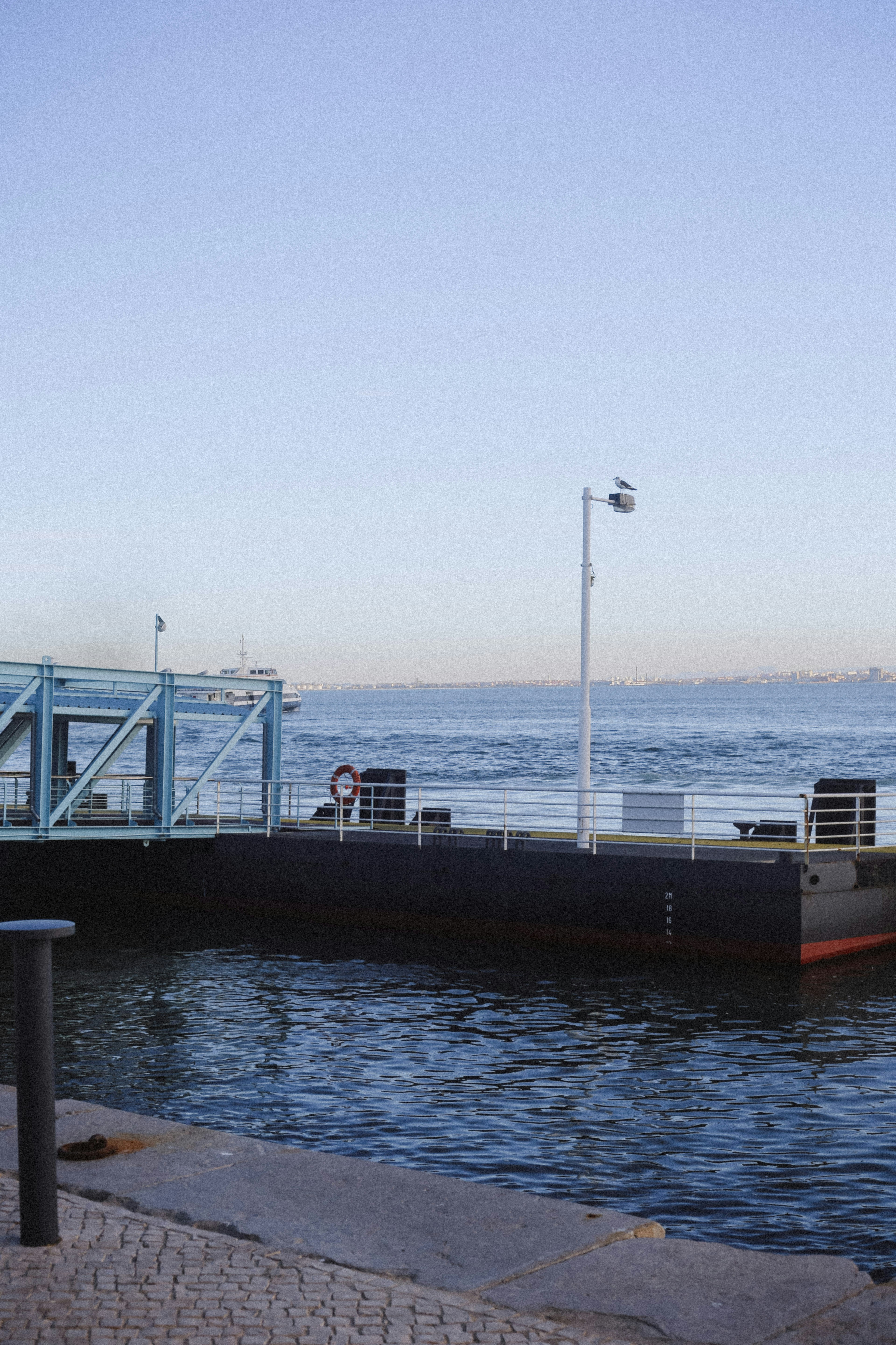 Harbor Edge: Quiet Pier Under a Clear Sky