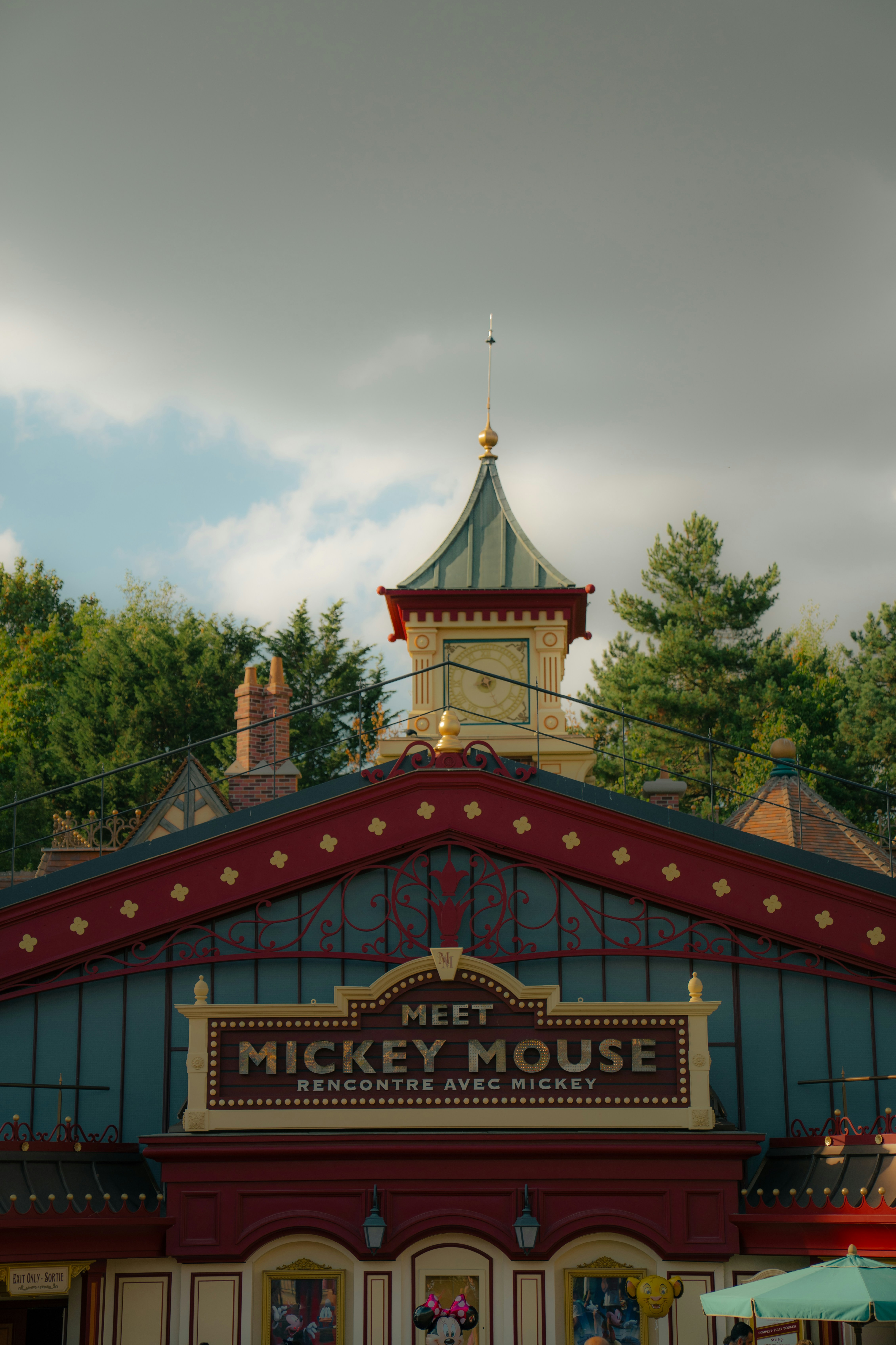 Mickey Mouse Meet Signage Beneath a Vintage Amusement Roof