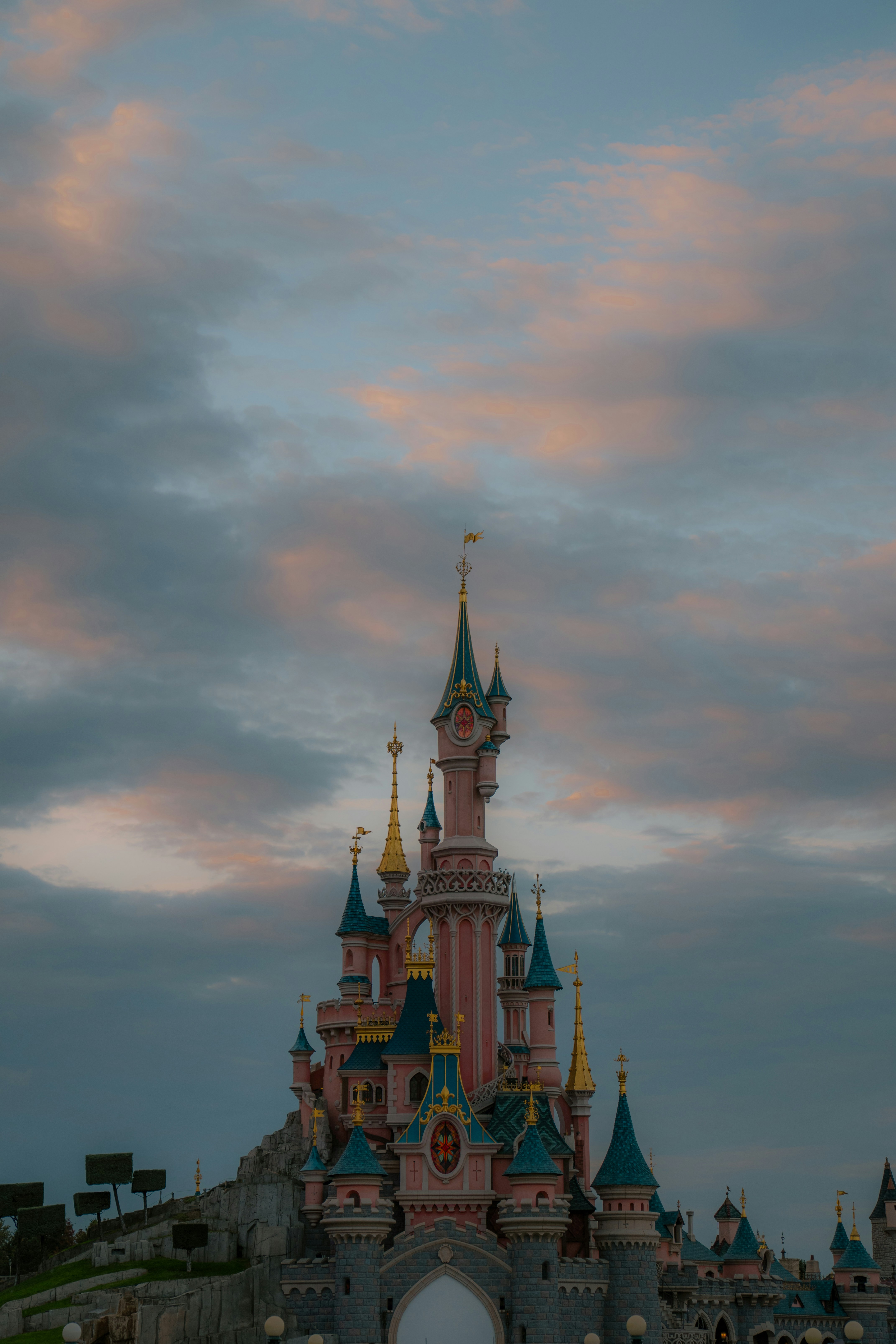 Castle in Twilight: A Pink Spire Rising Over the Hills