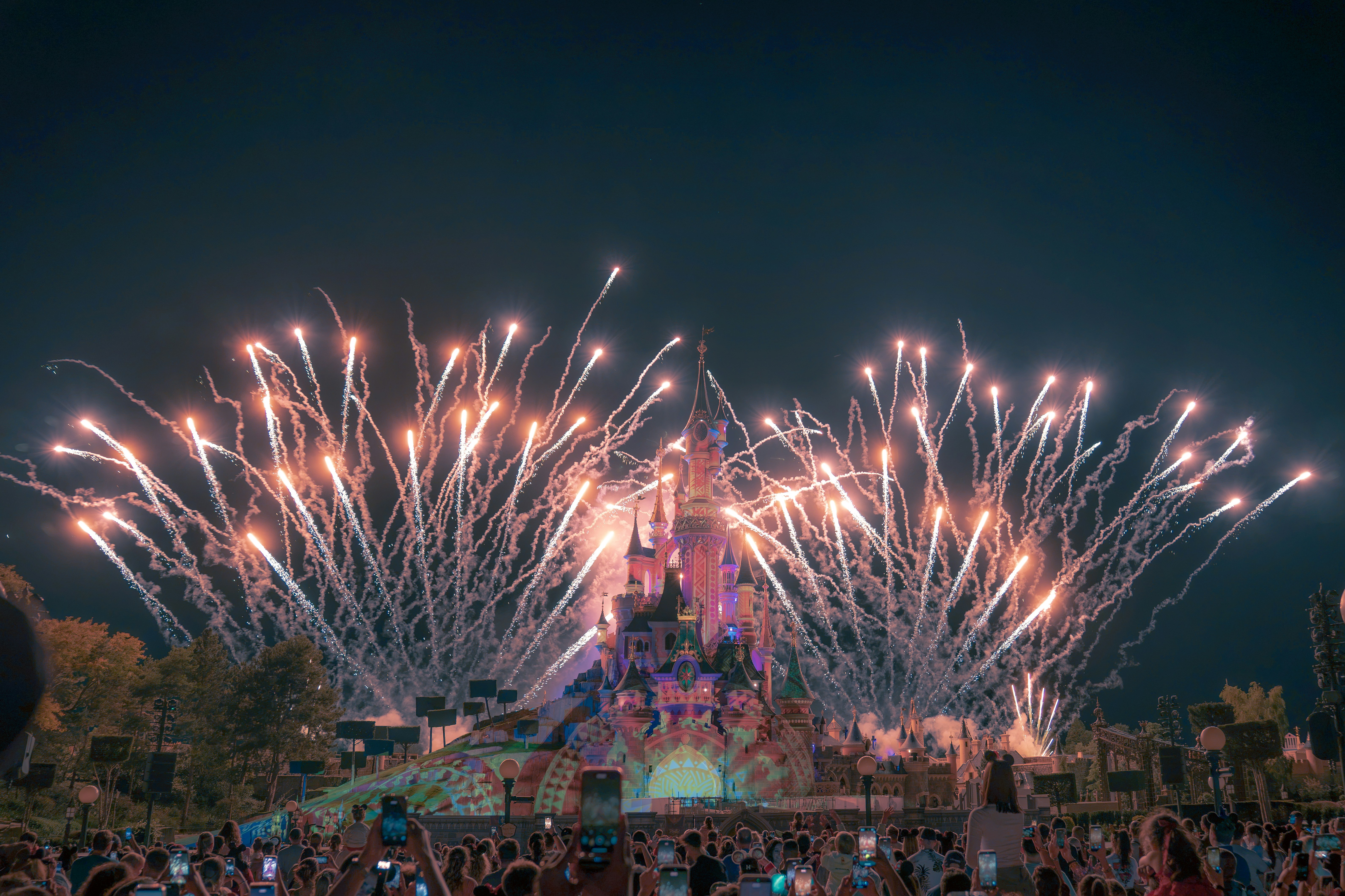 Midnight Celebration: Fireworks Bloom Over a Dreamlike Castle