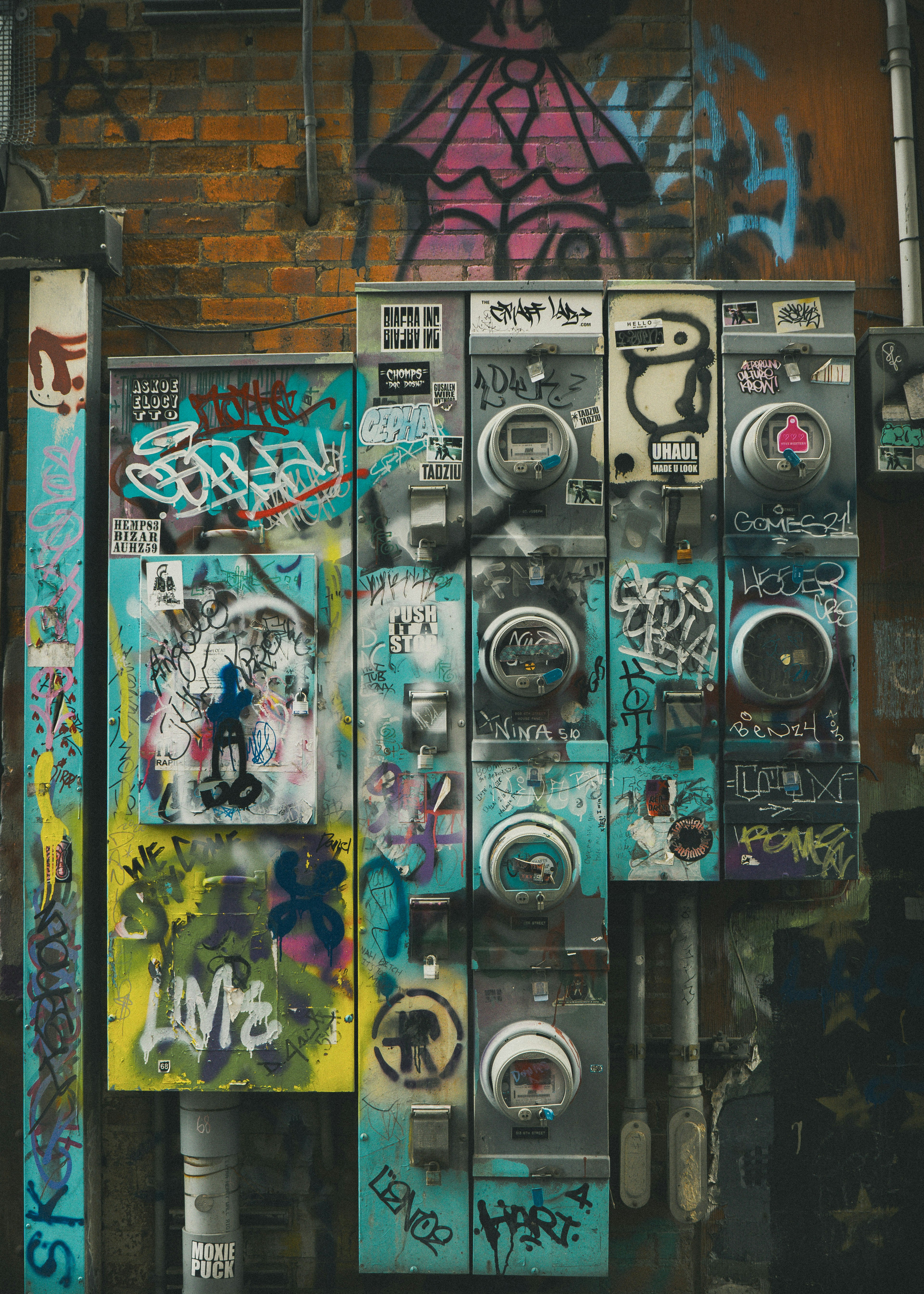 Graffiti Vault: Colorful Panels and Stenciled Faces on a City Wall