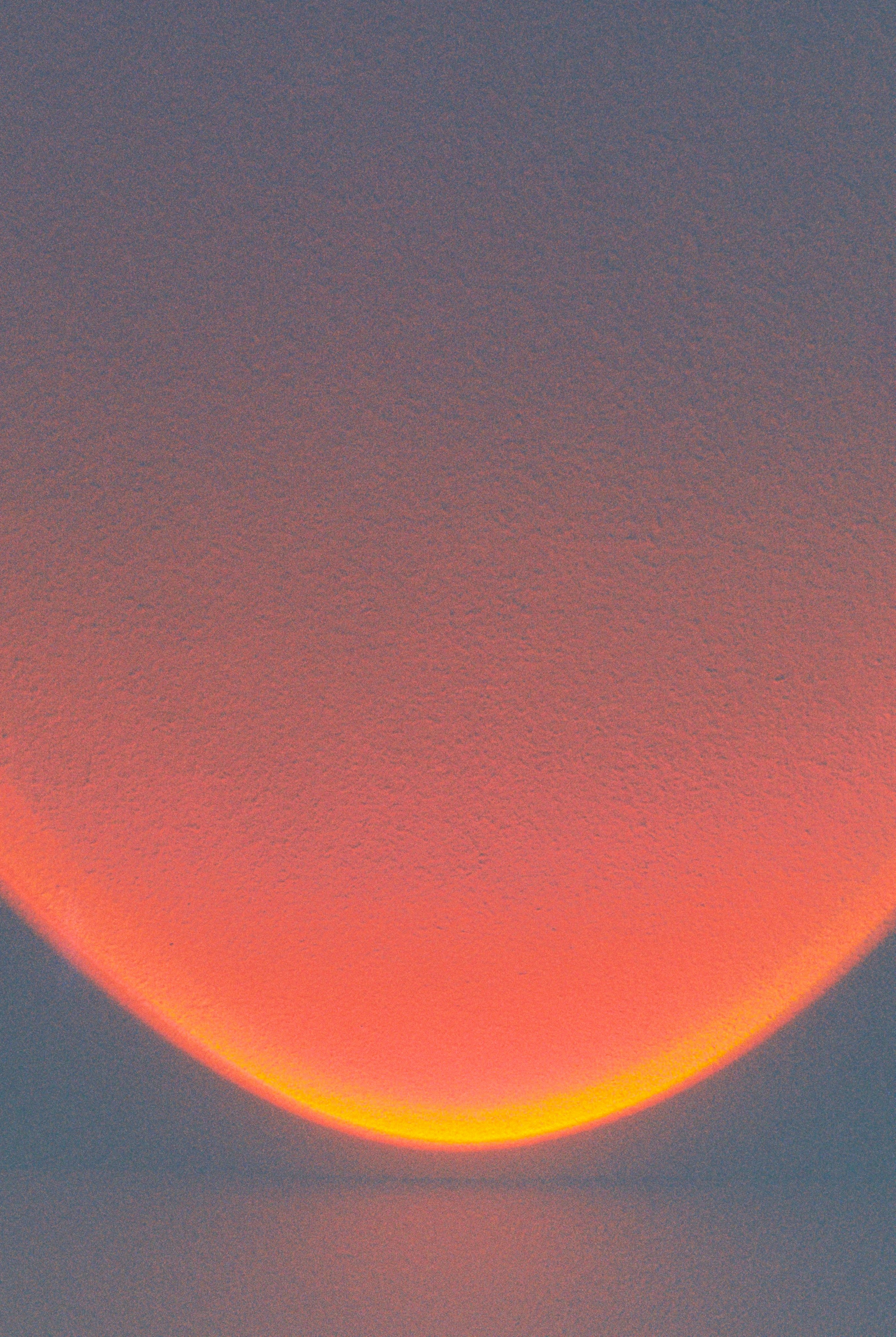 Sunset Arc: The Lower Hemisphere of Dusk Over Glassy Seas