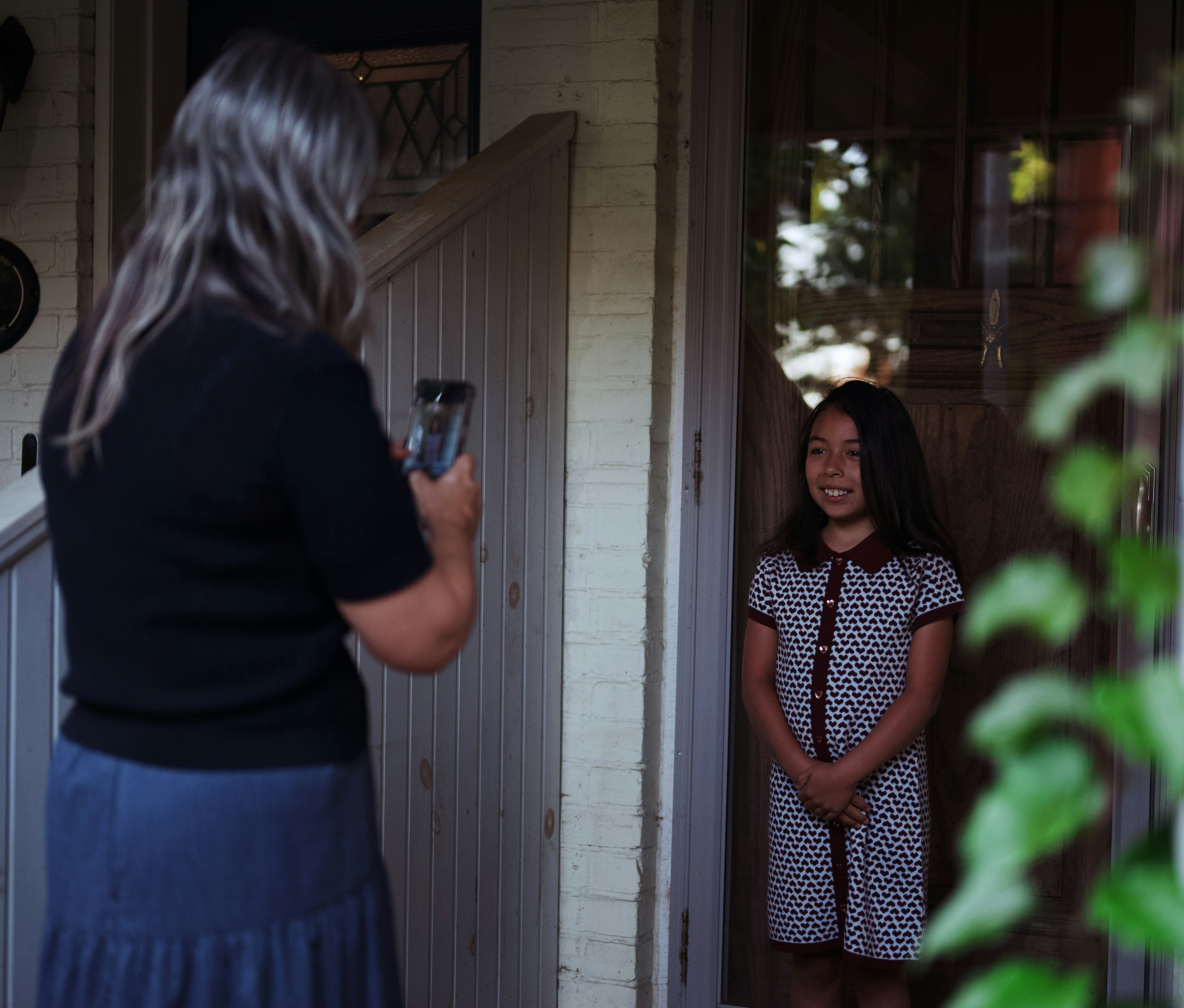 Portrait in the Doorway: A Moment Captured Between Presenter and Stranger