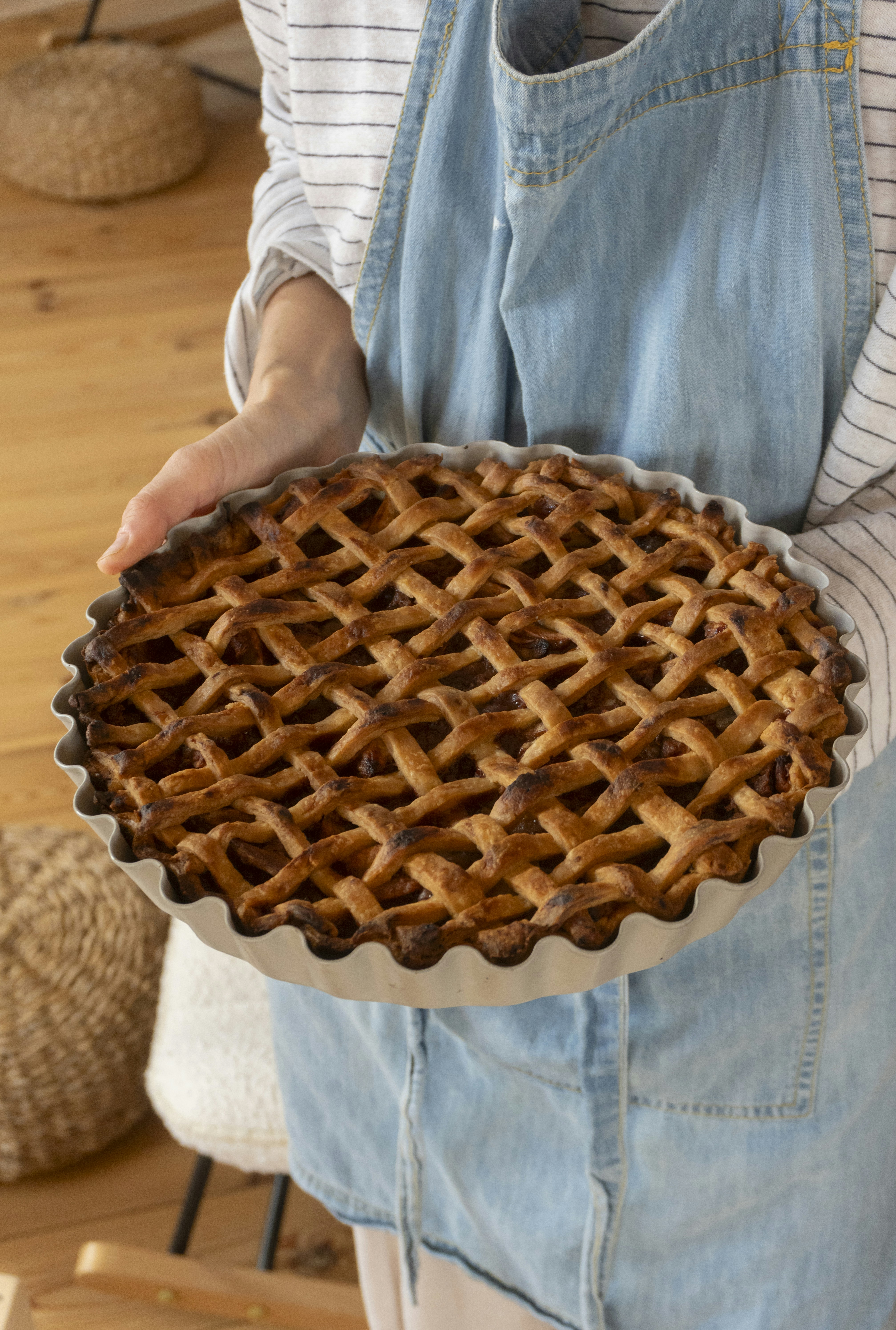 Hands-on Harvest: A Lattice-Top Pie Cradled in Denim