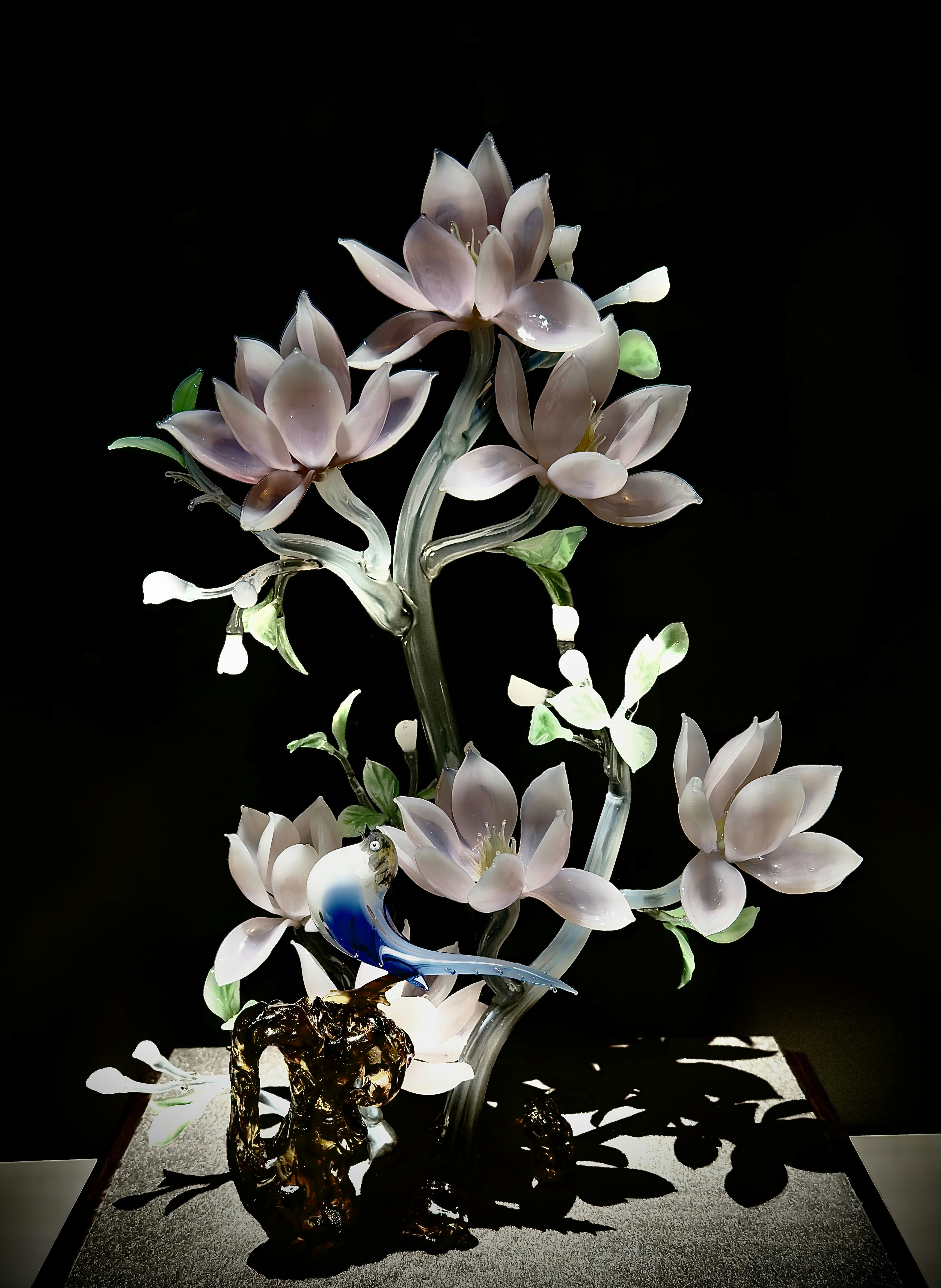 Pendant of Petals: A Night Studio Scene with a Blue Bird among Blooming Succulents