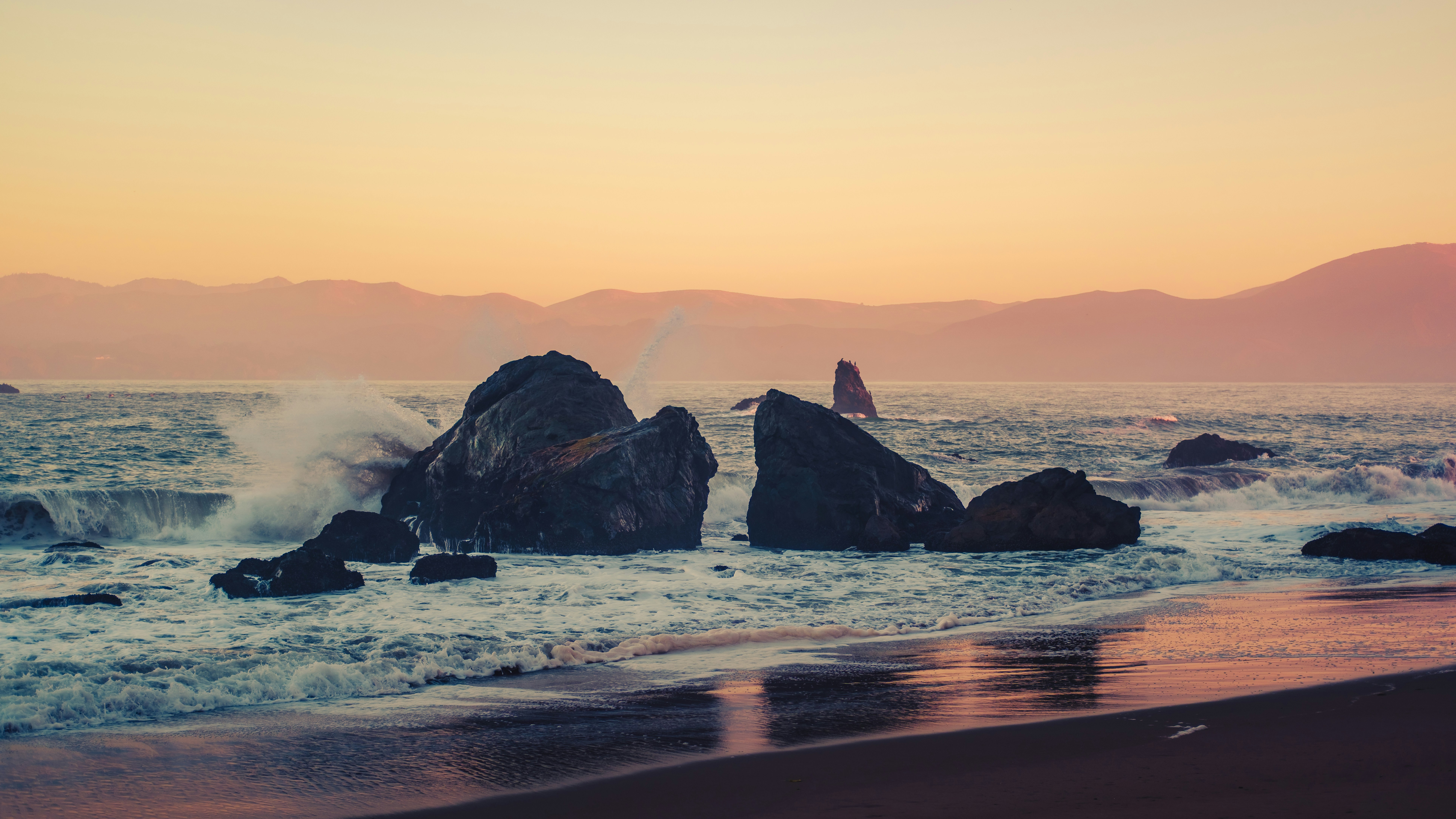 Sunset Breakers: Velvet Waves and Lone Rocks