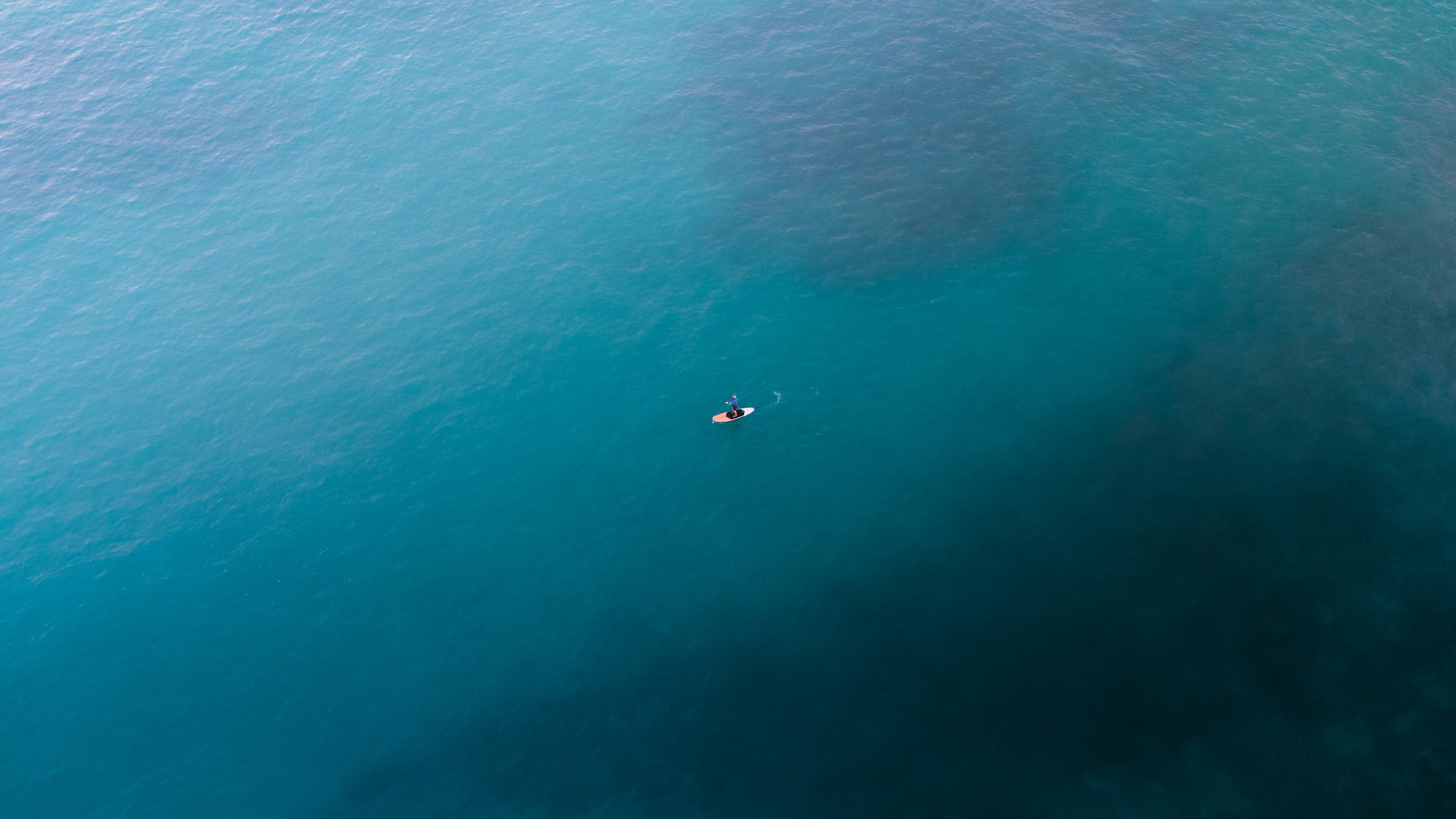 Isolated Vessel Poised in Oceanic Blue