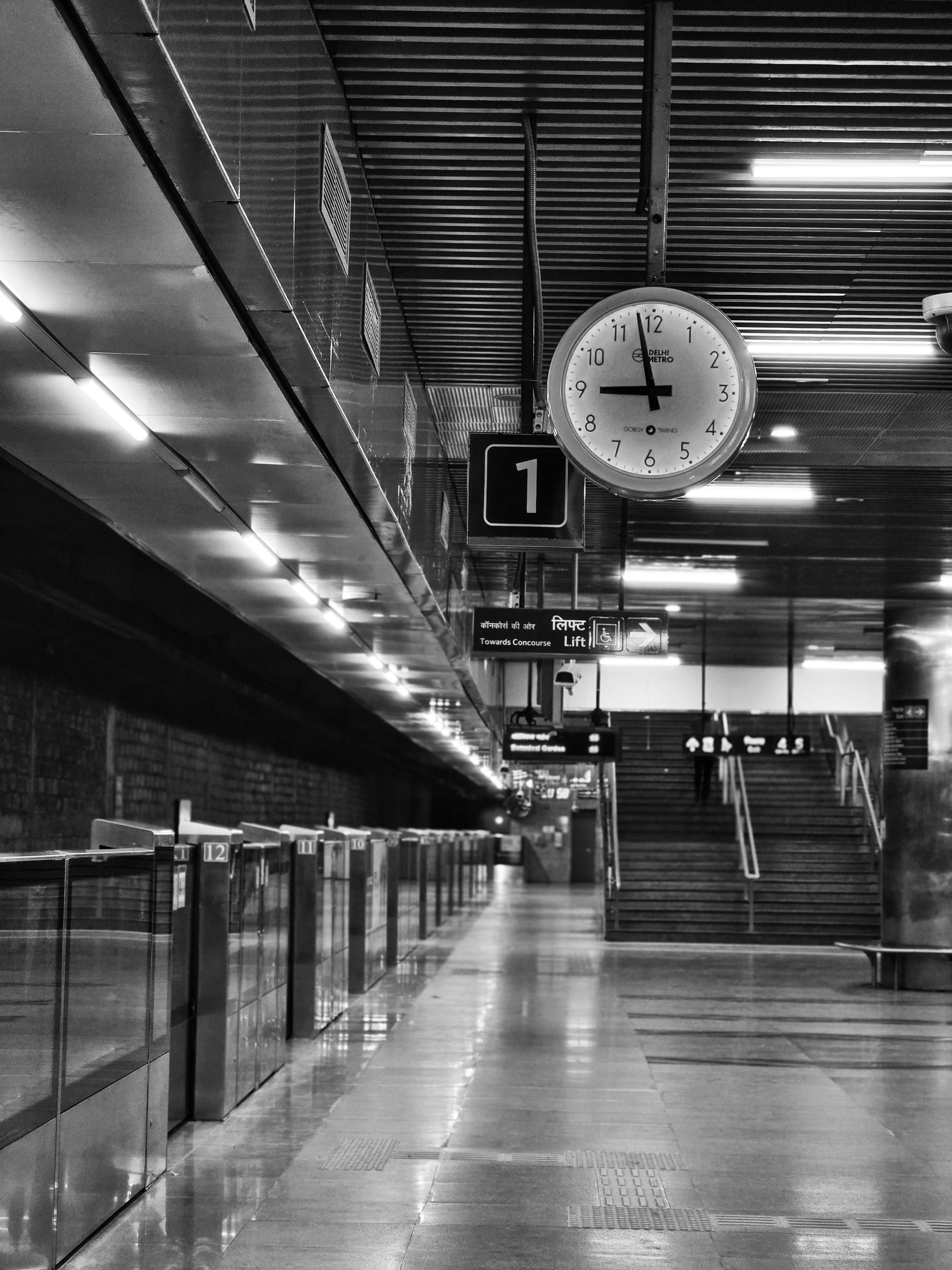 Clock Over Platform: A Quiet Moment in Monochrome Underground
