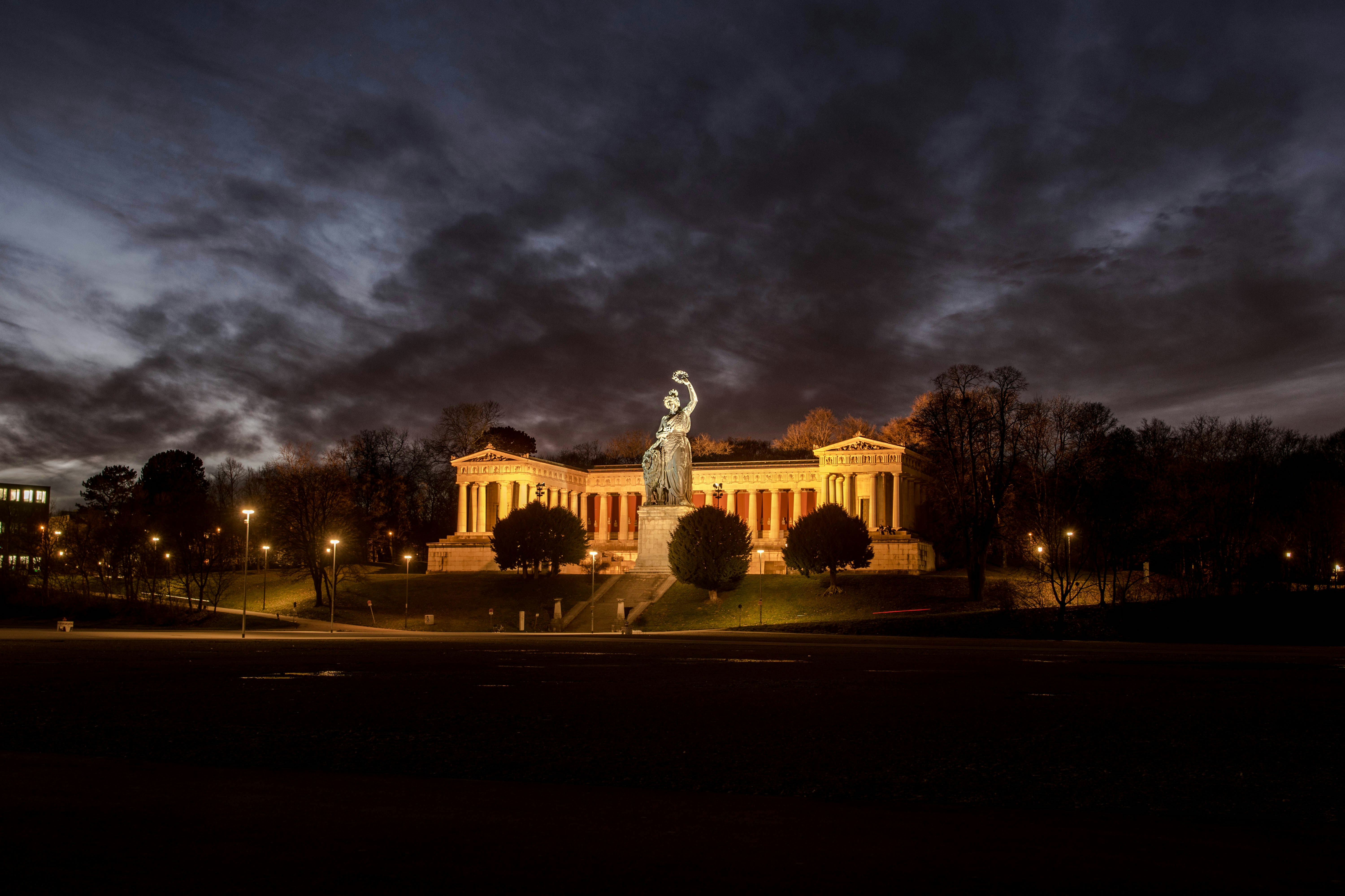 Lamps and Statue at Dusk: The National Monument Stands Awake