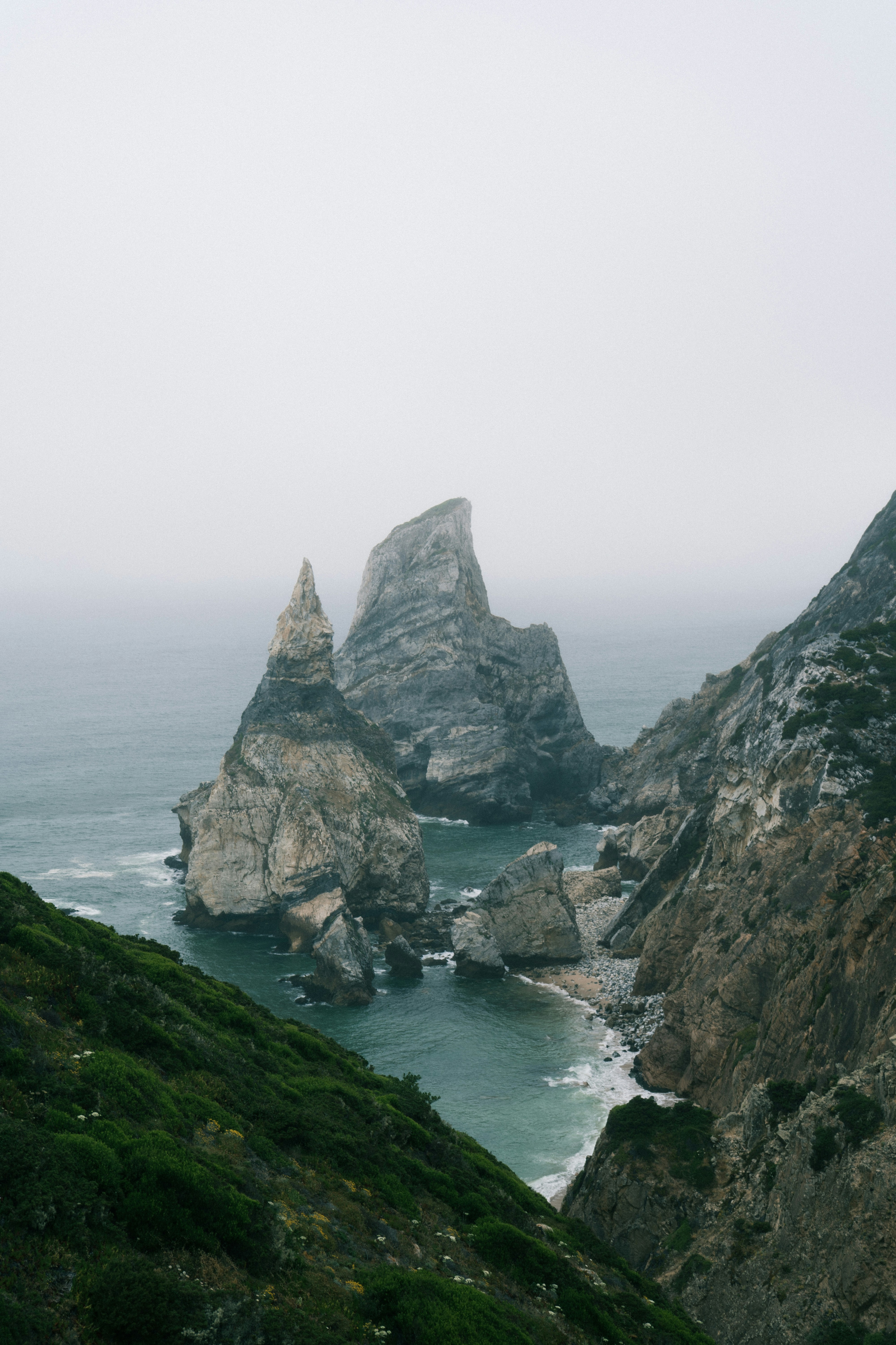 Sea Stack Cathedral: Jagged Rocks Beneath a Misty Coast