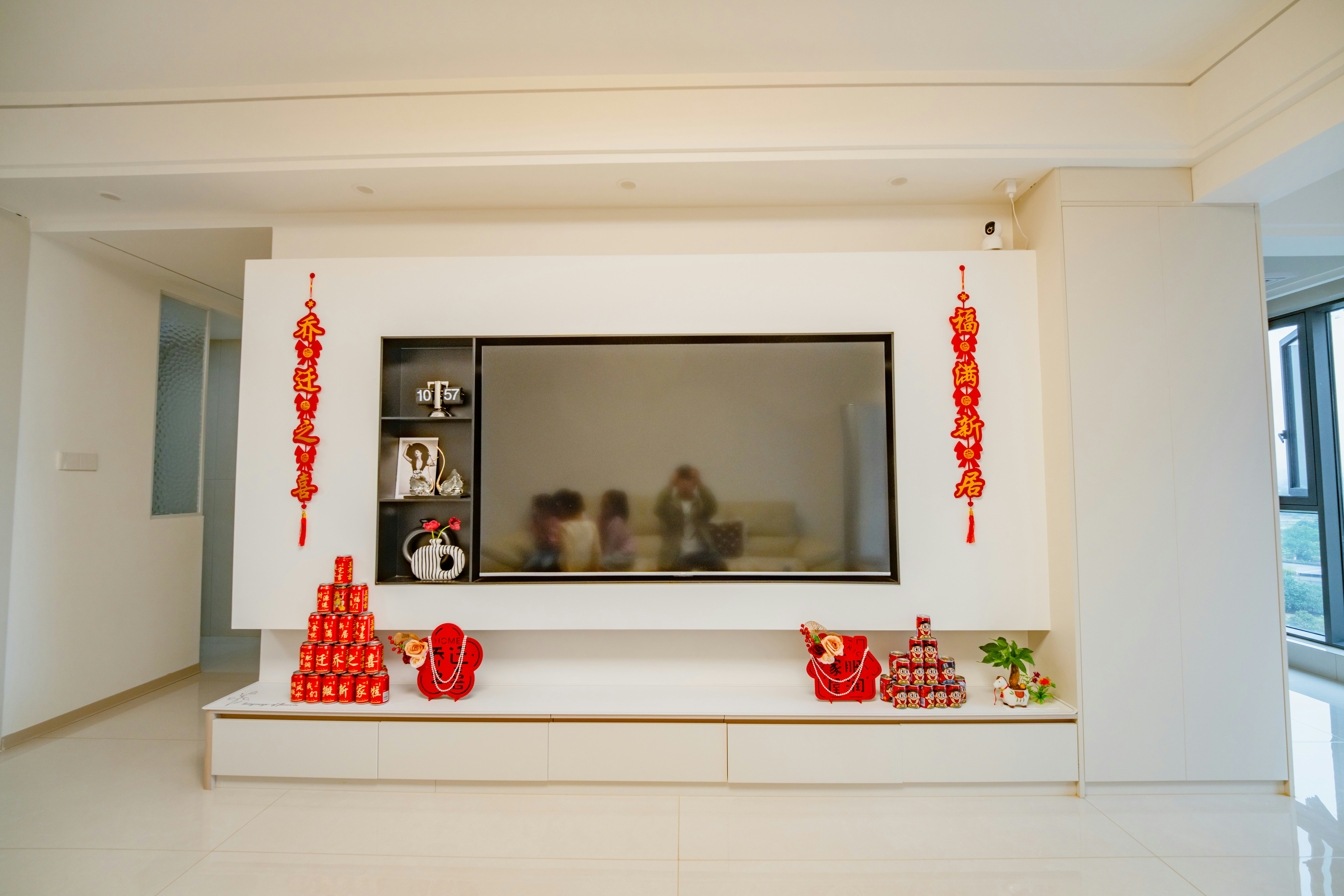 Festive Red Lanterns Framing a Minimalist TV Nook